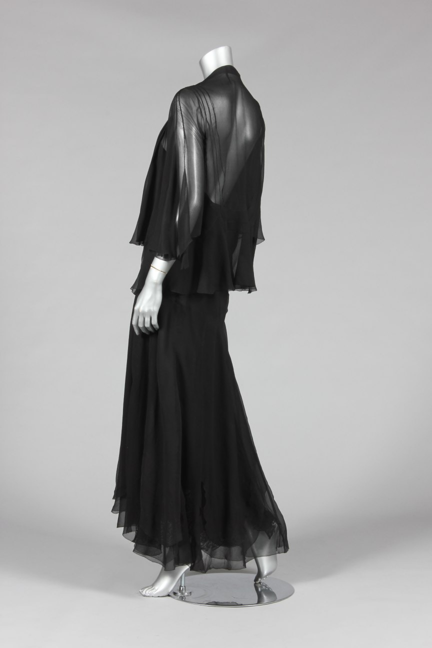 Lot 61 - A Chanel couture black chiffon evening jacket