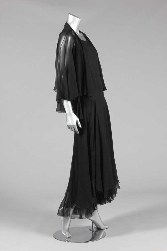 Lot 61 - A Chanel couture black chiffon evening jacket