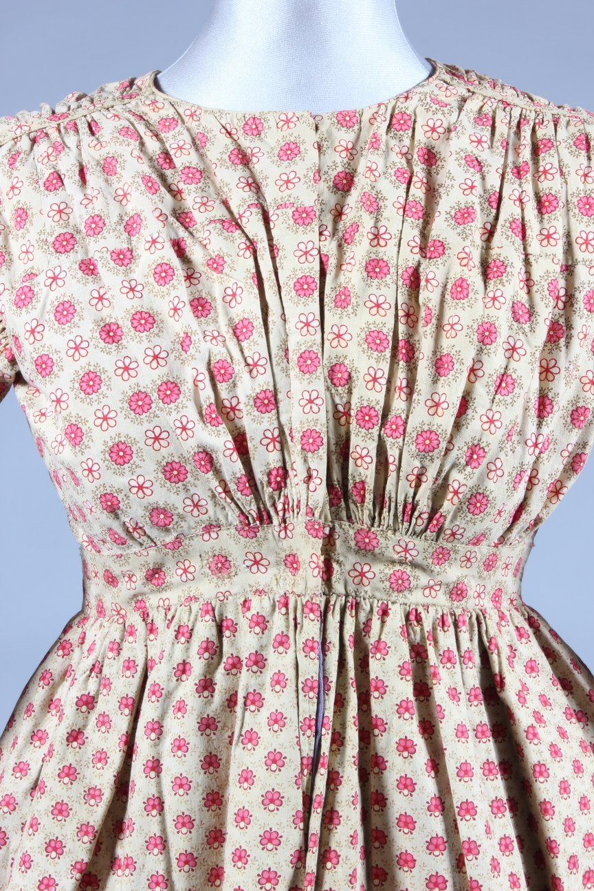 Lot 151 - A printed cotton day dress, late 1830s, the