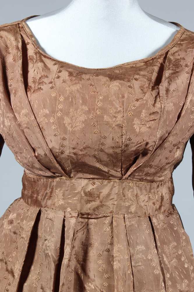 Lot 155 - A brown silk damask gown, circa 1830, with