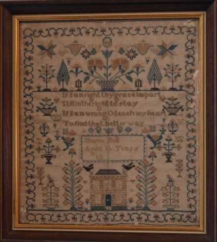 Lot 540 - An embroidered house sampler by Maria Bull,
