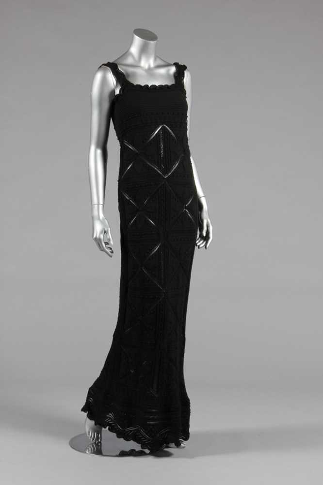 Lot 442 - A Chanel black knitted dress, labelled and