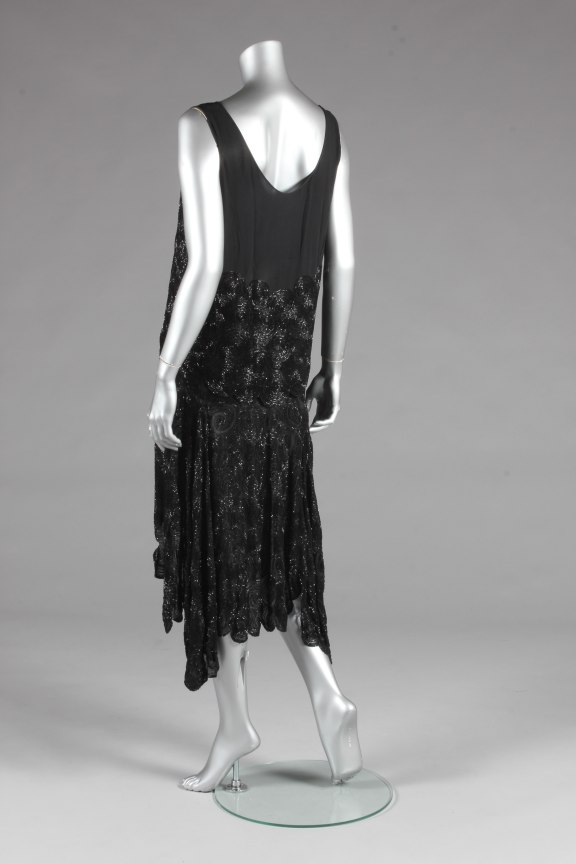 Lot 75 - A black beaded flapper dress, circa 1929,