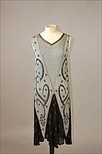 Lot 200 - A beaded flapper dress, circa 1928, of pale
