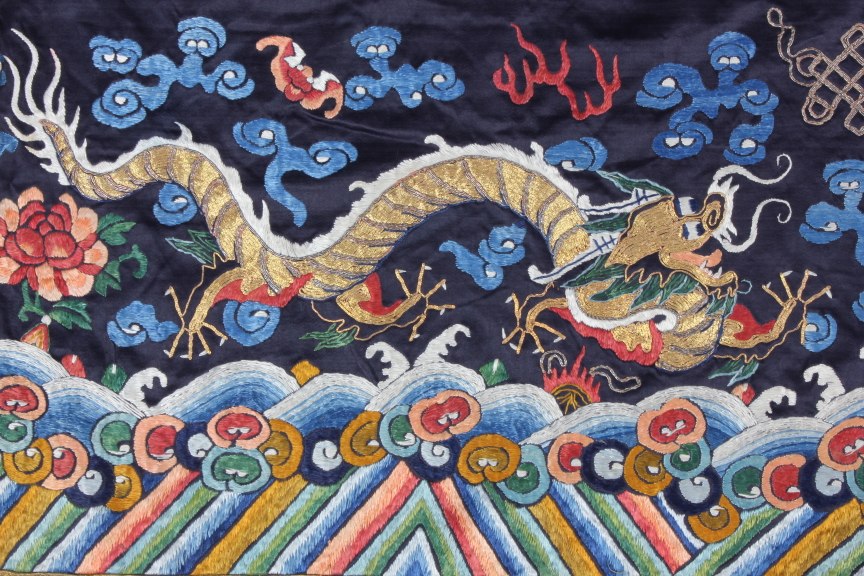 Lot 231 - An embroidered midnight blue satin chaofu