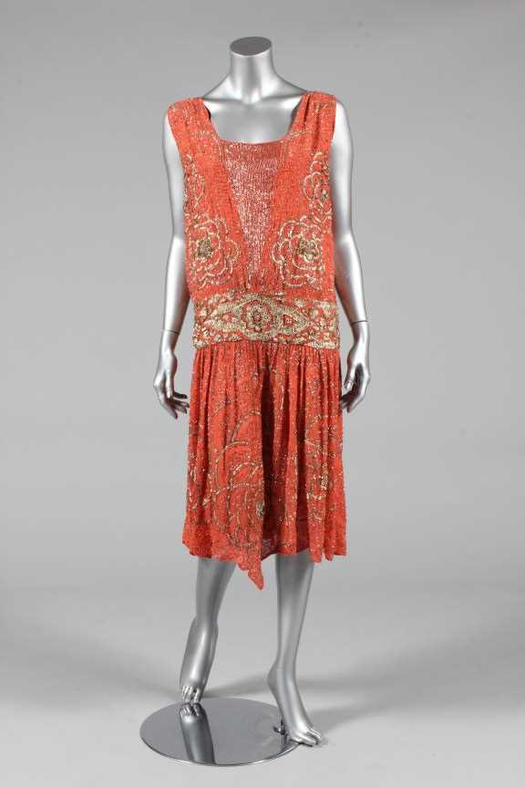 Lot 296 - A beaded coral crepe flapper dress, circa