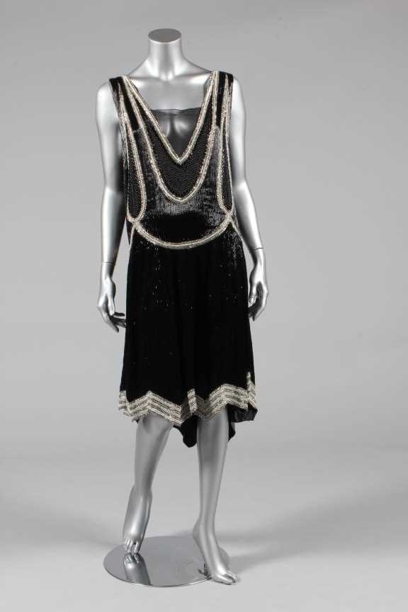 Lot 303 - A black beaded flapper dress, circa 1928,