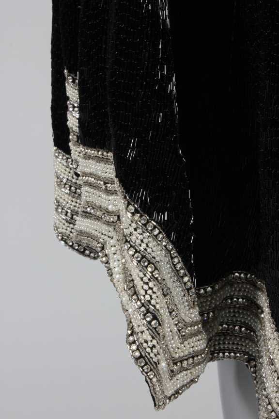 Lot 303 - A black beaded flapper dress, circa 1928,