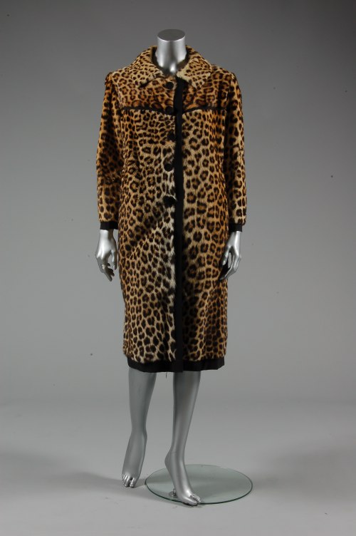 Lot 178 - A leopard skin coat, circa 1965, with black