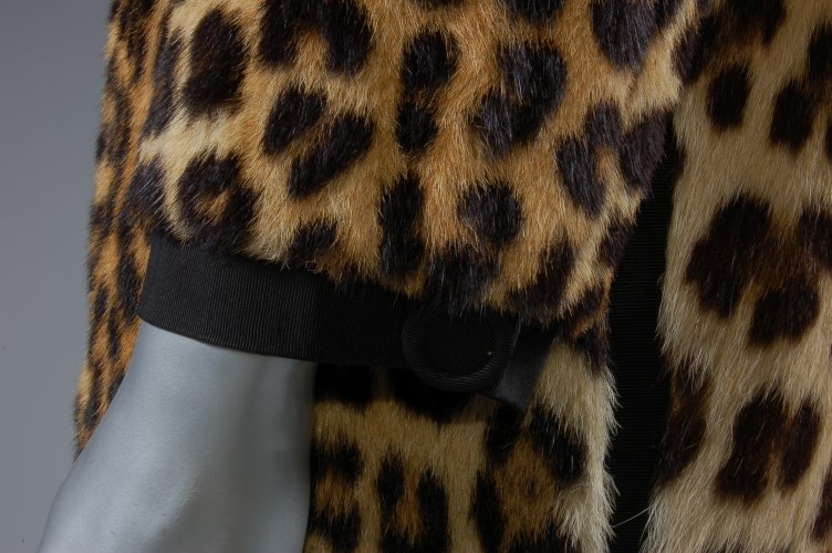 Lot 178 - A leopard skin coat, circa 1965, with black