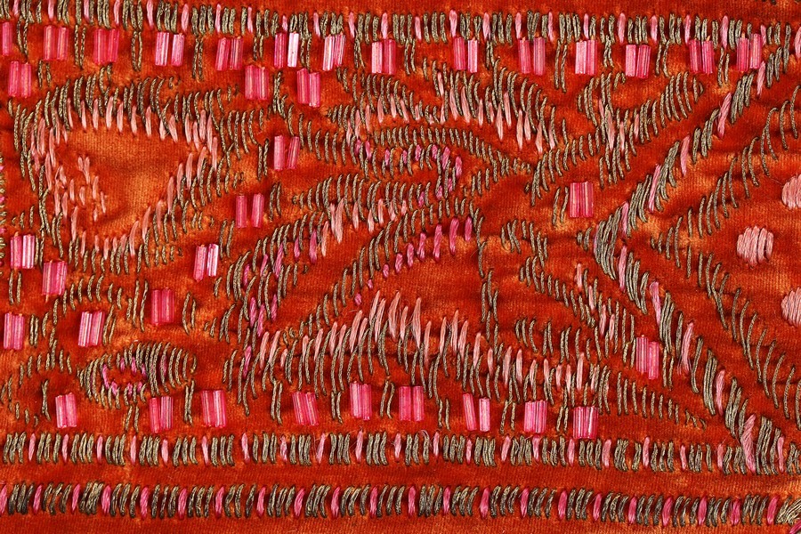 Lot 57 - An embroidered brick-red velvet couture