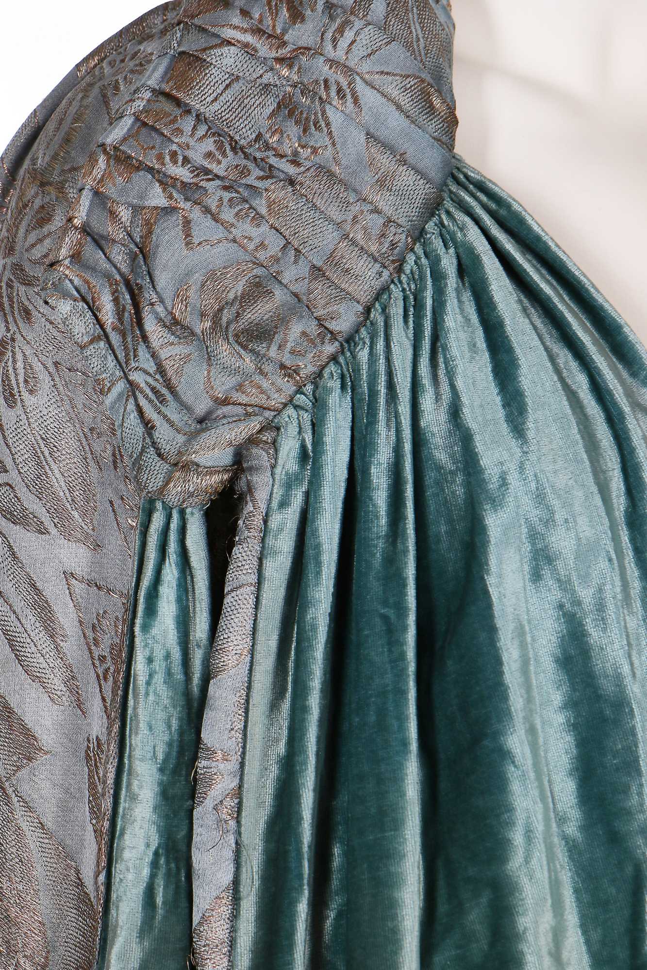 Lot 21 - A lamé evening cloak in shades of blue and