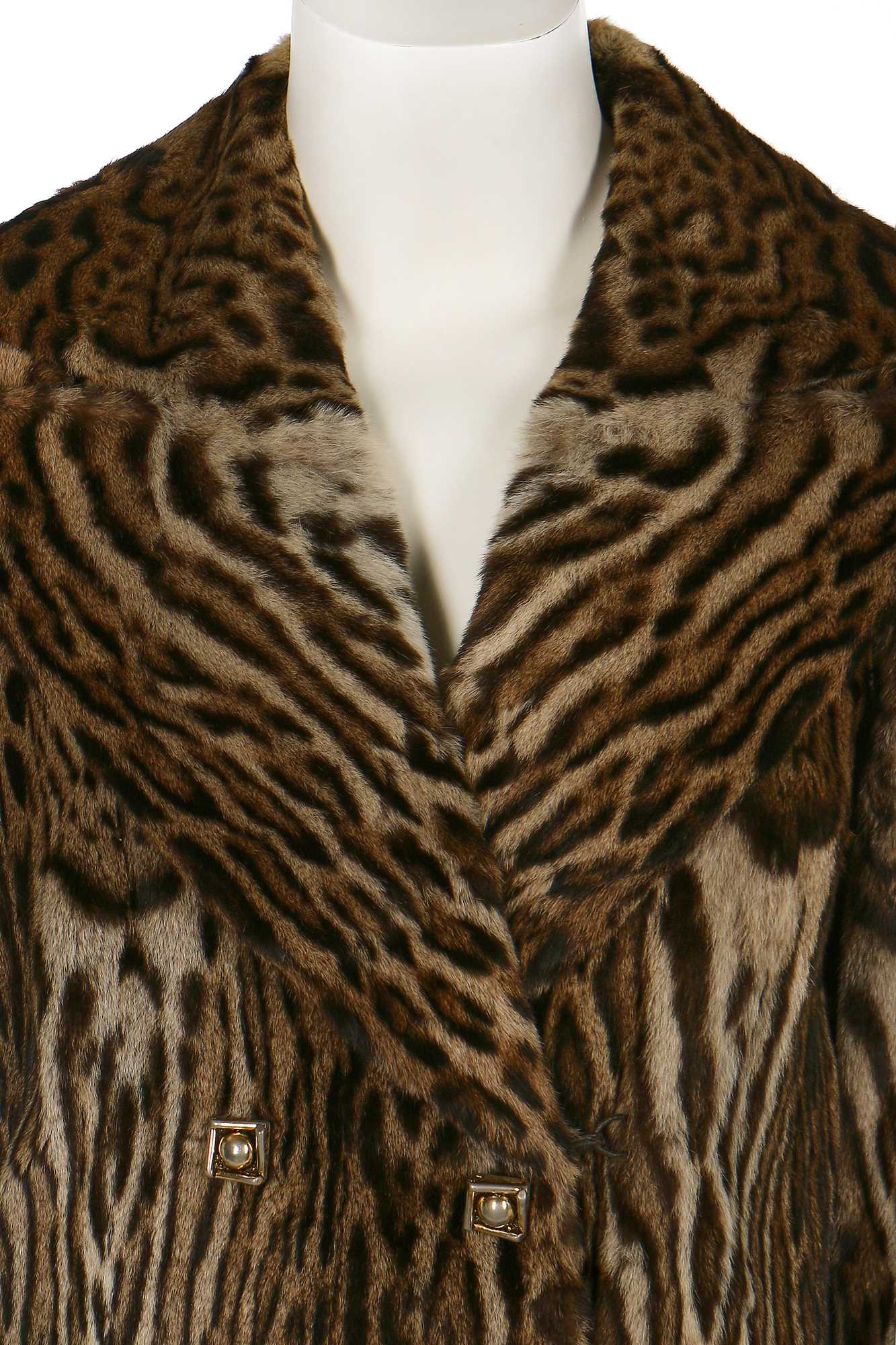 Lot 136 - An ocelot fur coat, early 1970s,