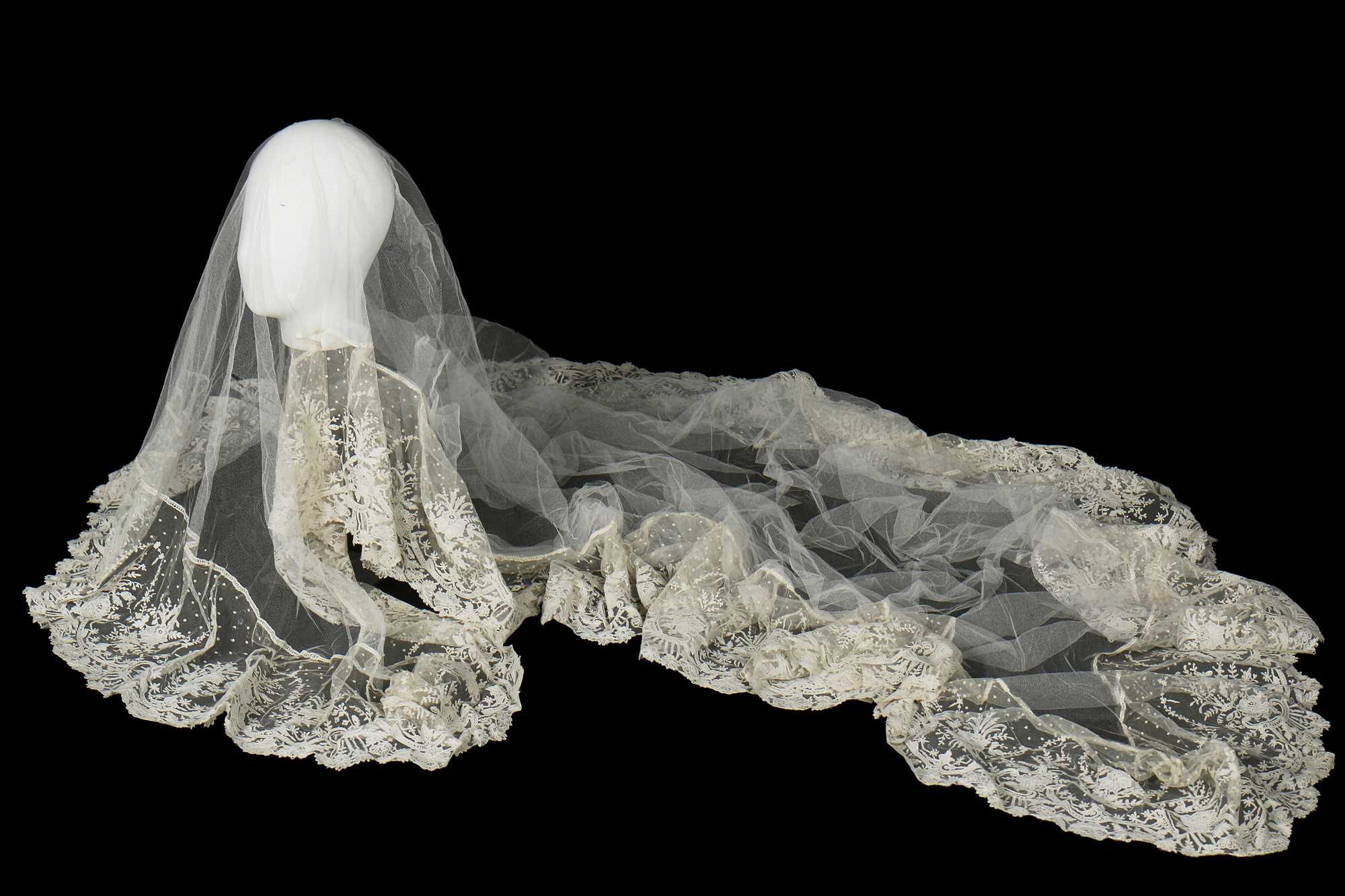 Lot 457 - A tulle bridal veil edged in 1860s Brussels