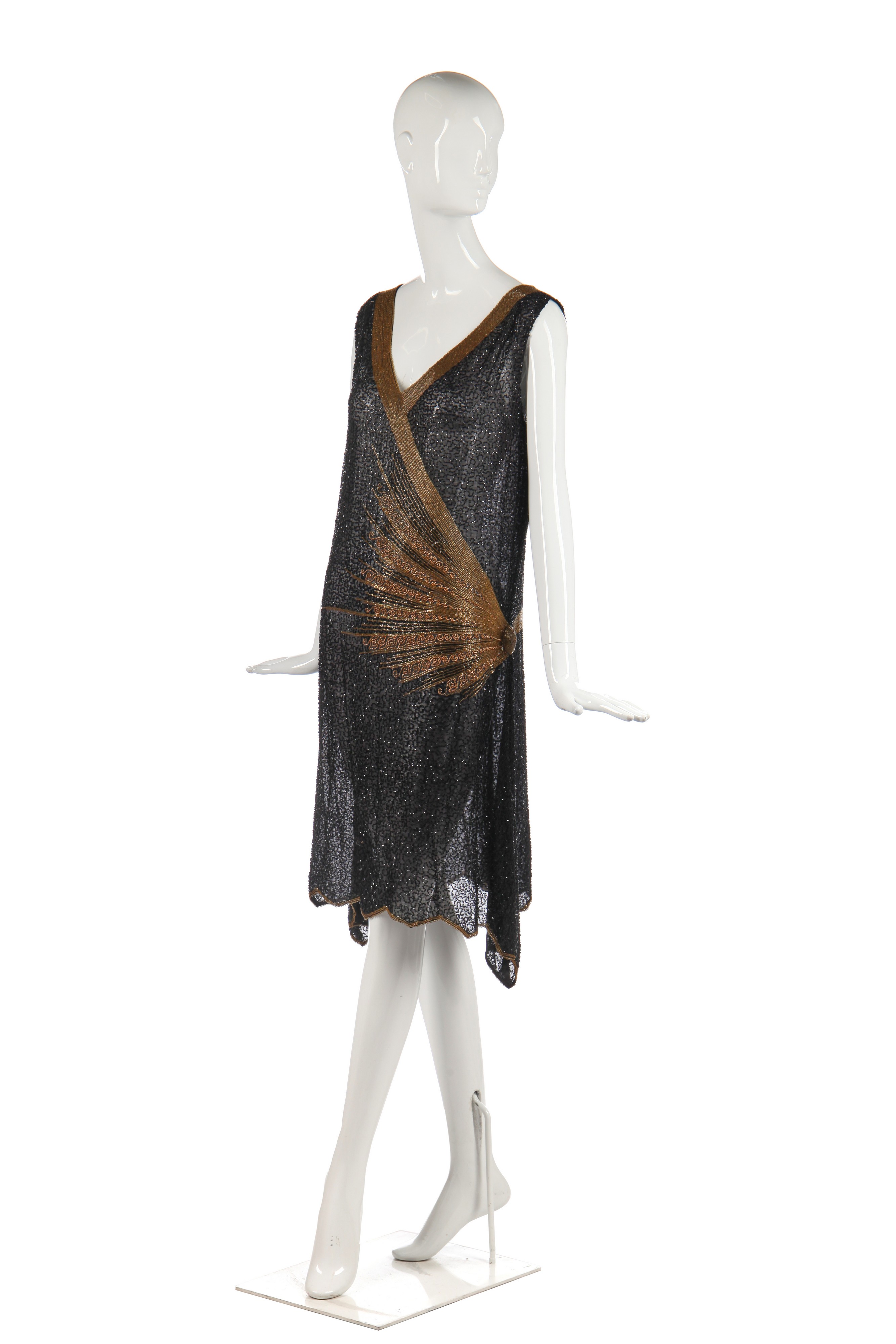 Lot 244 - A black and gold beaded flapper dress,
