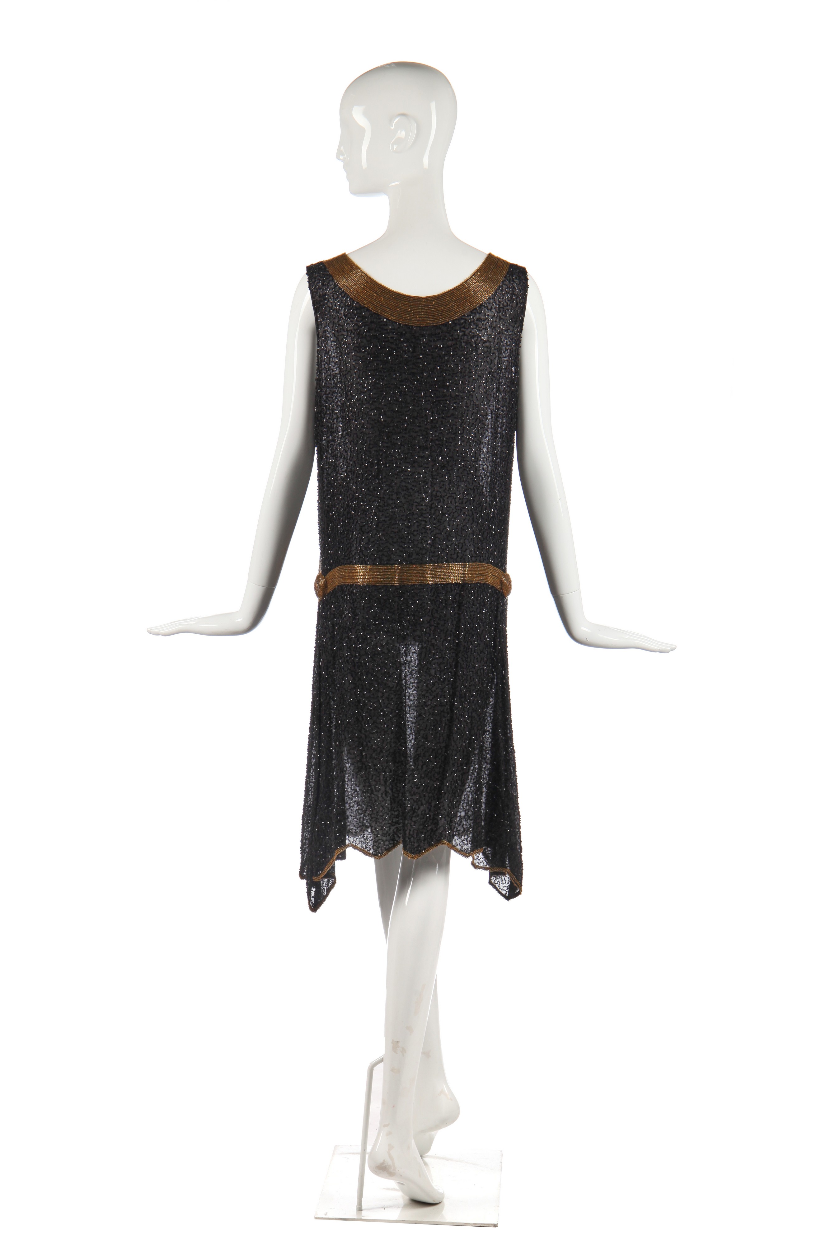 Lot 244 - A black and gold beaded flapper dress,