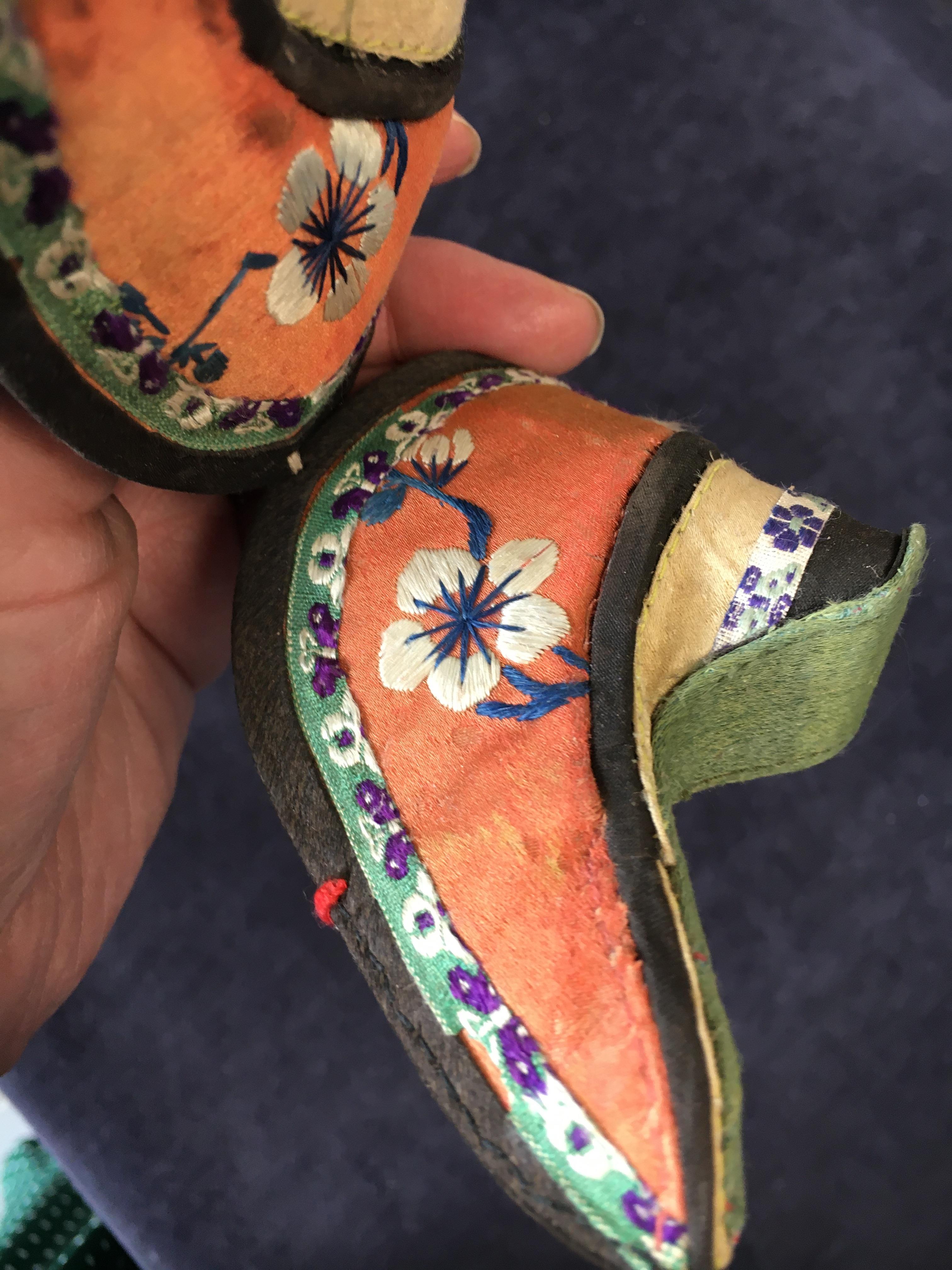 Lot 469 - A pair of embroidered silk 'Lotus bud' shoes