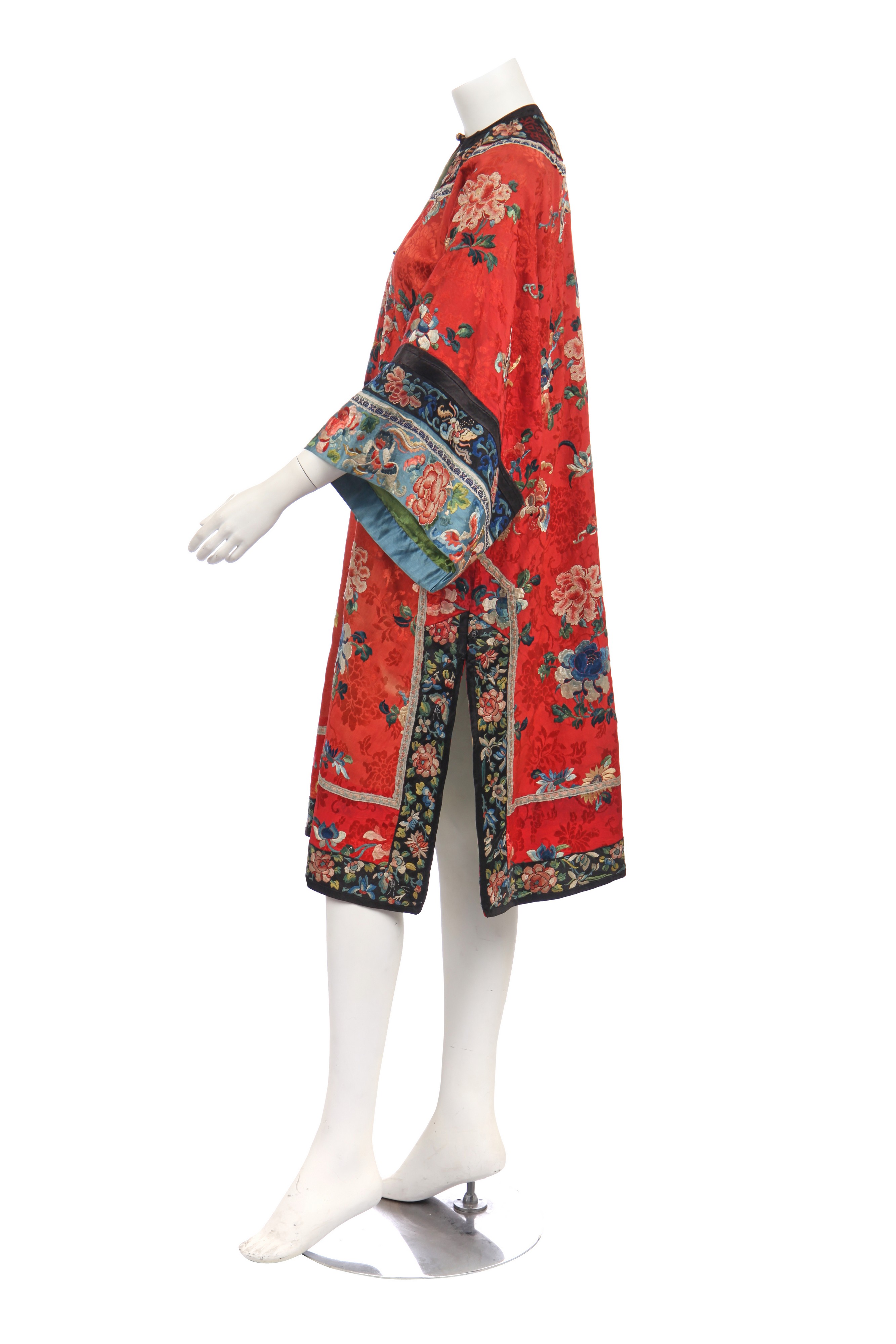 Lot 492 - An embroidered red damask silk chang-fu,