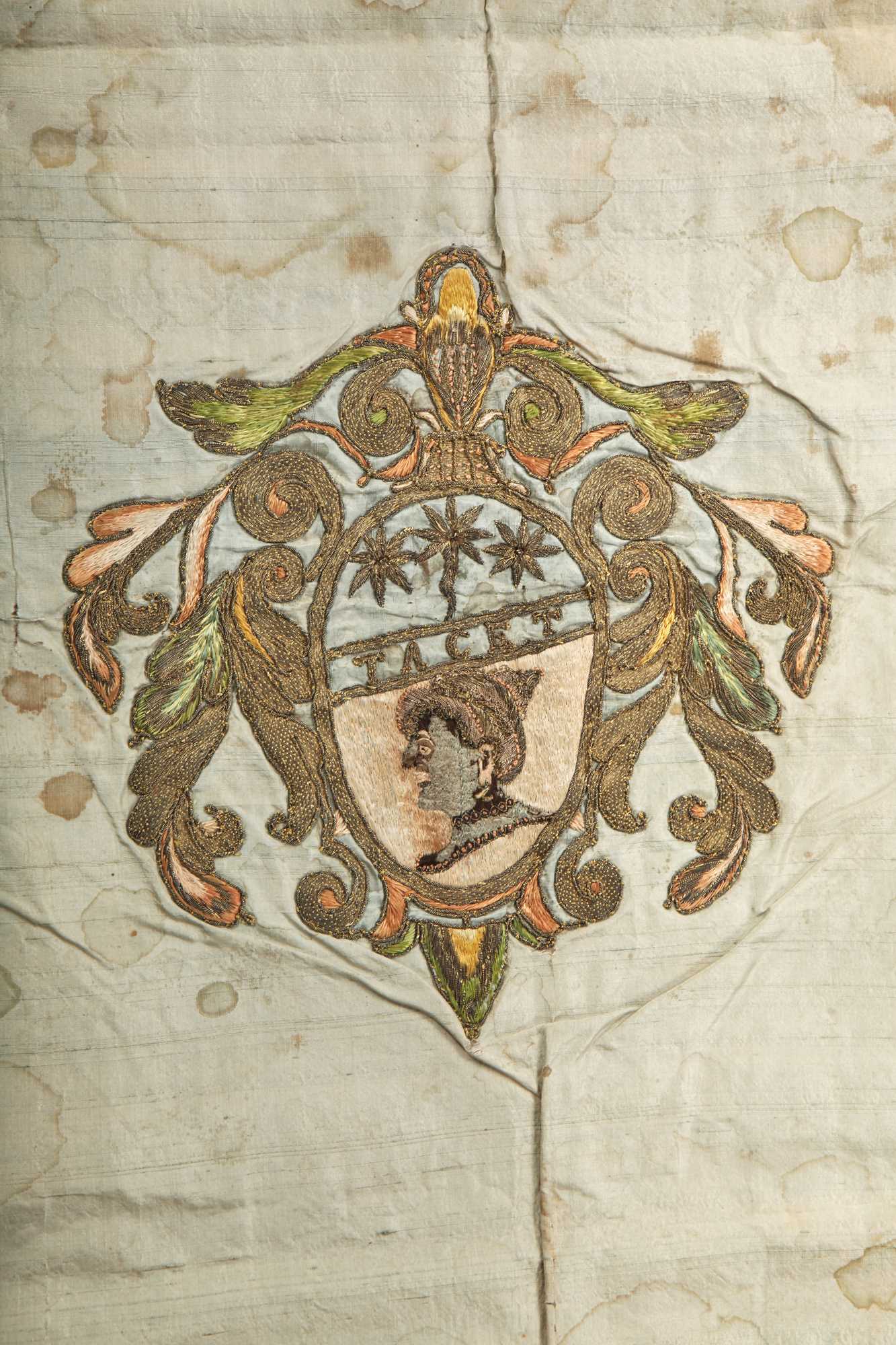 Lot 527 - An embroidered heraldic bearing cloth, cover,