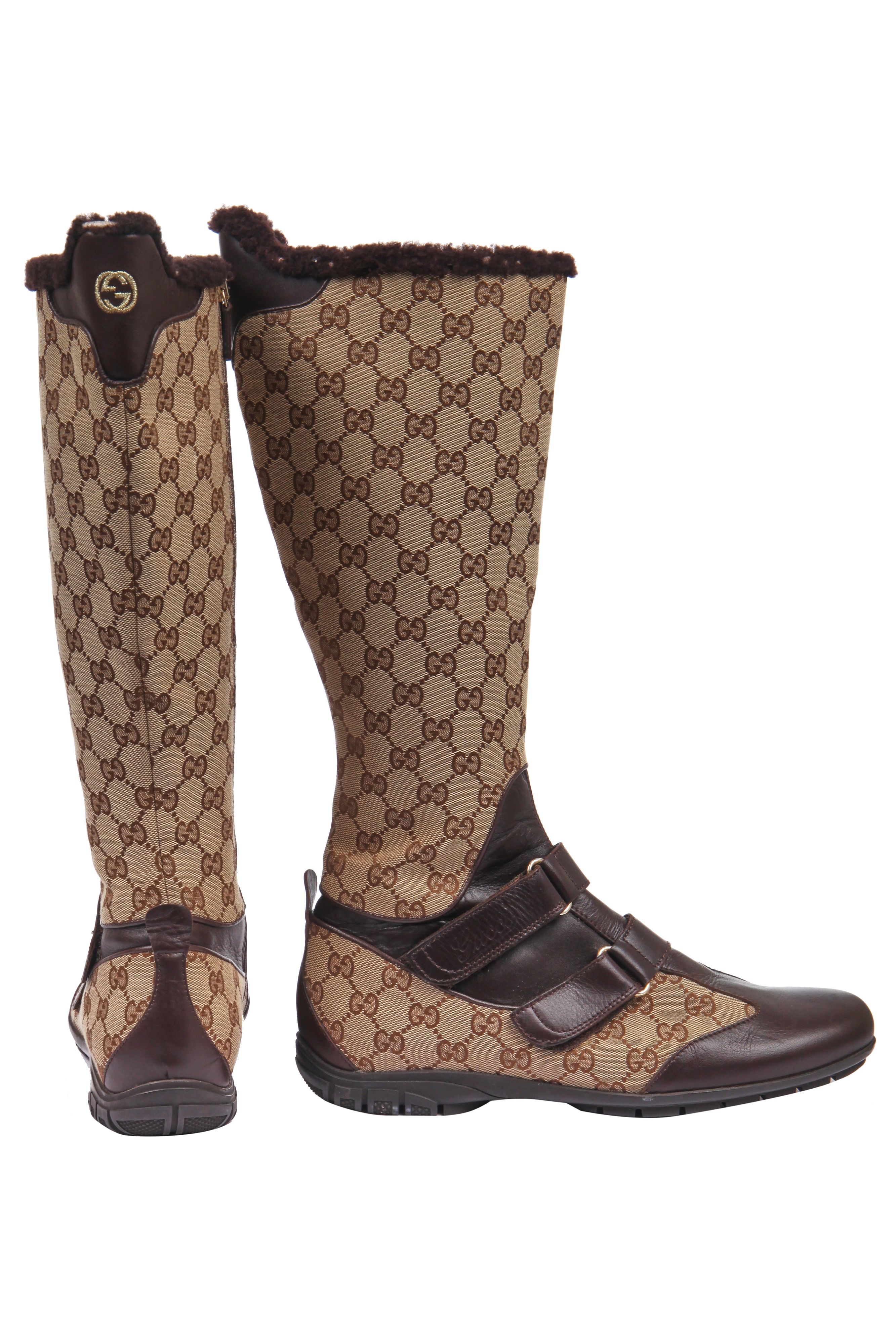 Lot 112 - A pair of Gucci monogrammed canvas boots,
