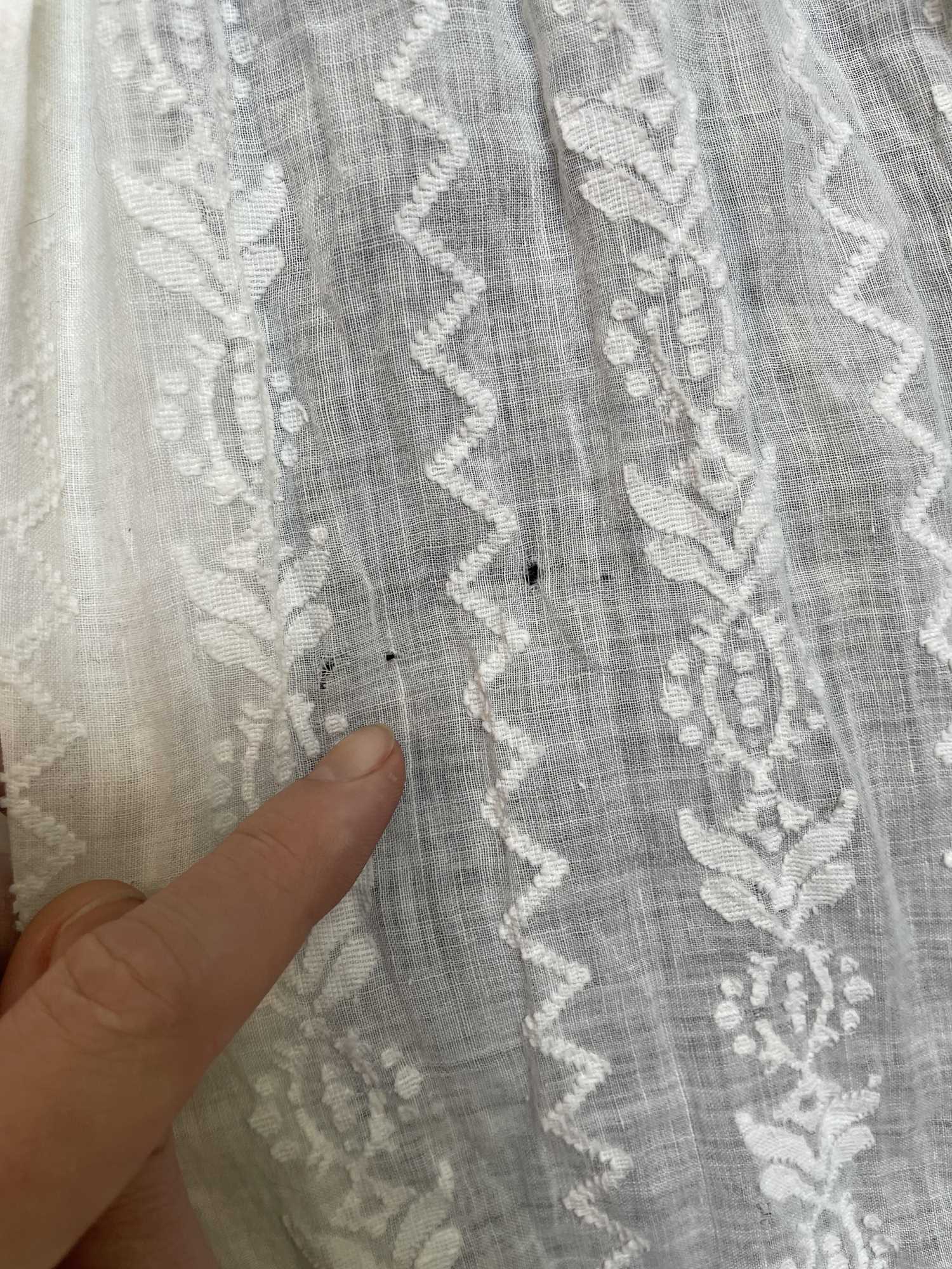 Lot 212 - A rare woven muslin round gown, circa 1795,