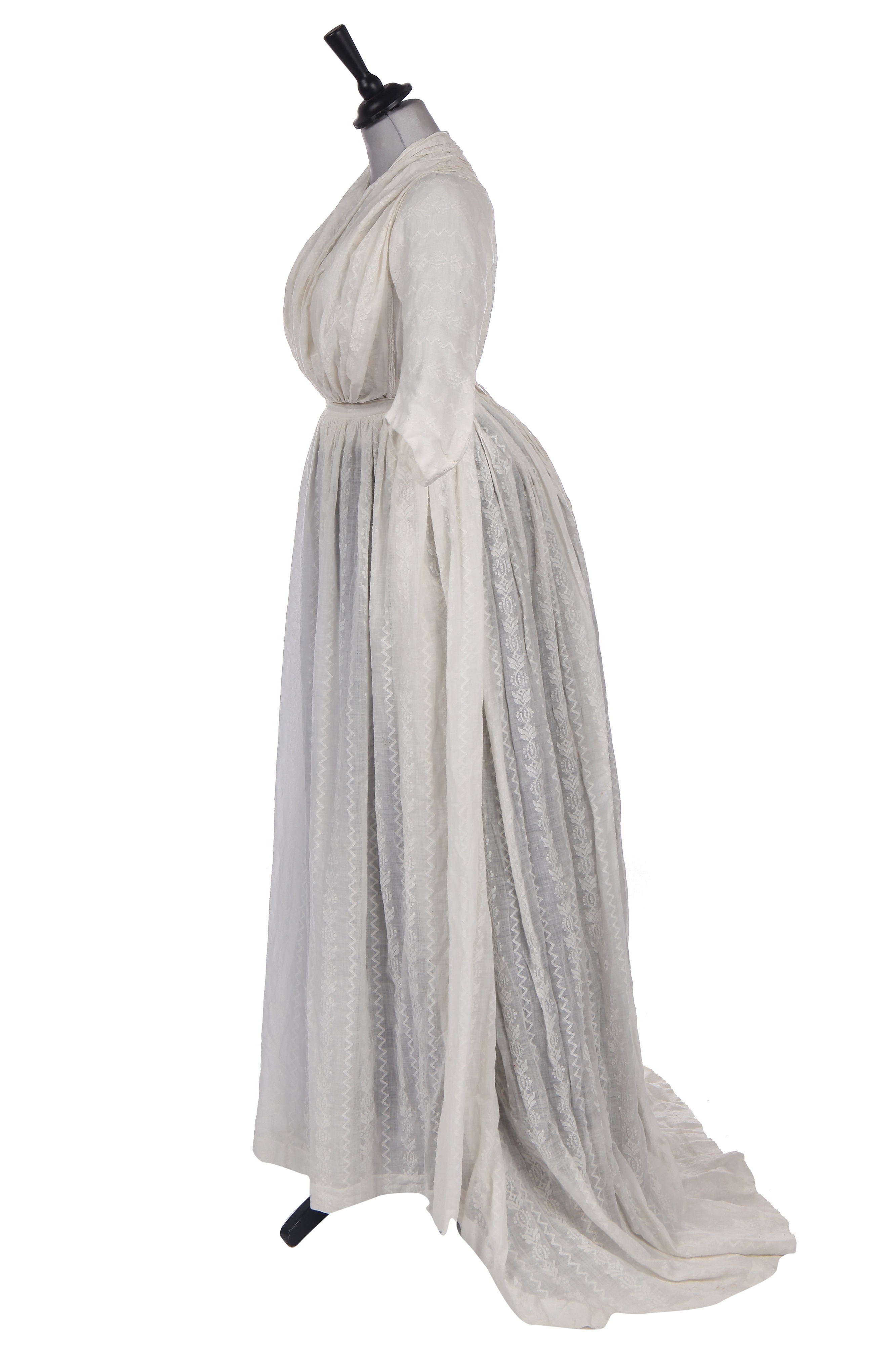 Lot 212 - A rare woven muslin round gown, circa 1795,