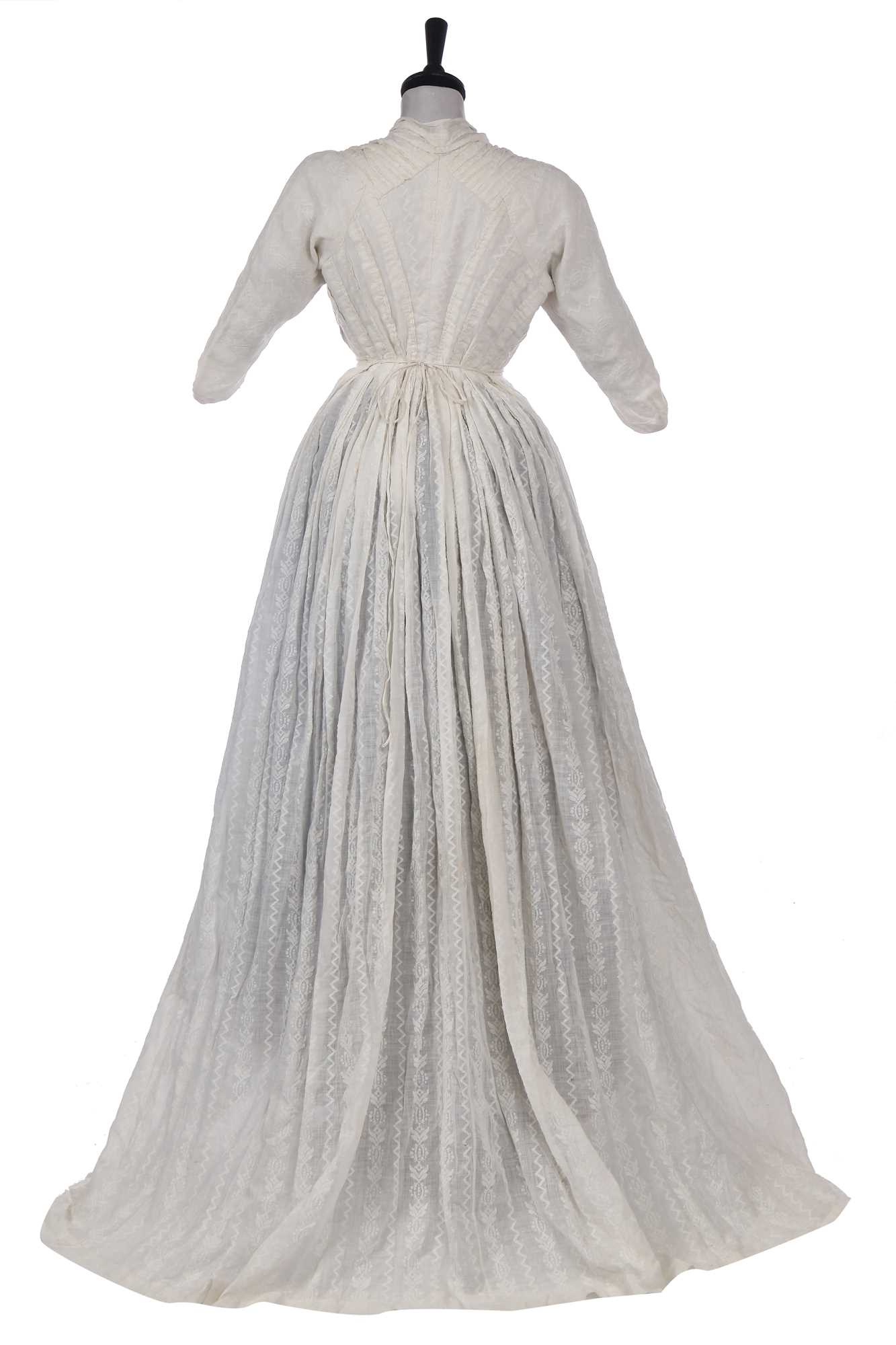 Lot 212 - A rare woven muslin round gown, circa 1795,