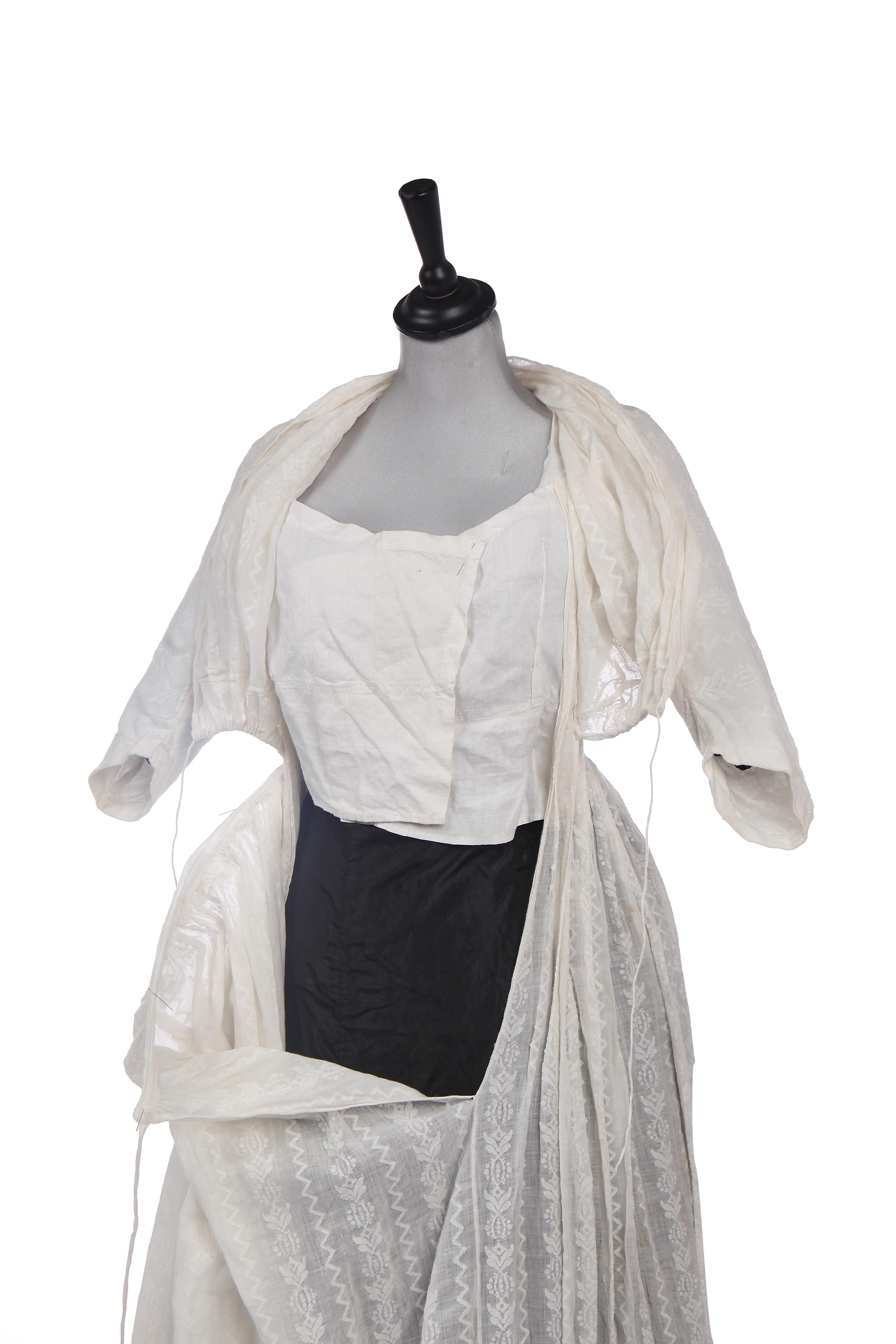 Lot 212 - A rare woven muslin round gown, circa 1795,