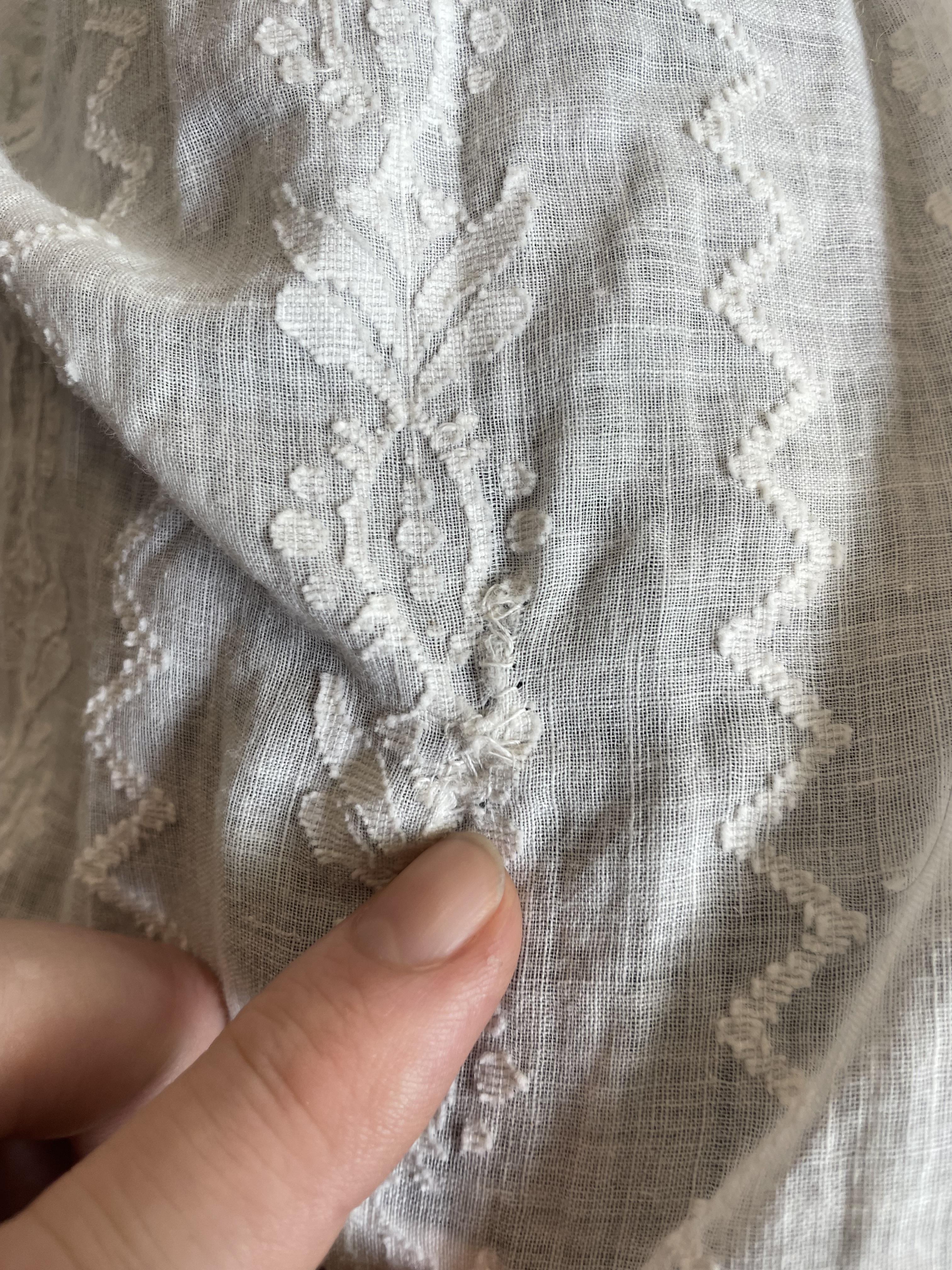 Lot 212 - A rare woven muslin round gown, circa 1795,