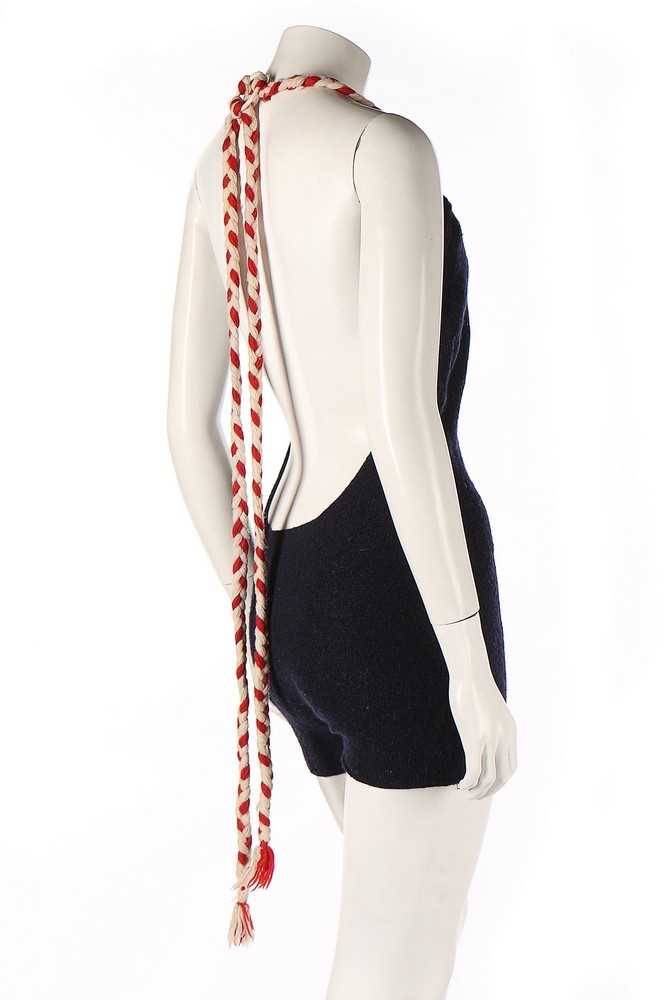 Lot 269 - A hand-knitted navy wool swimsuit with red