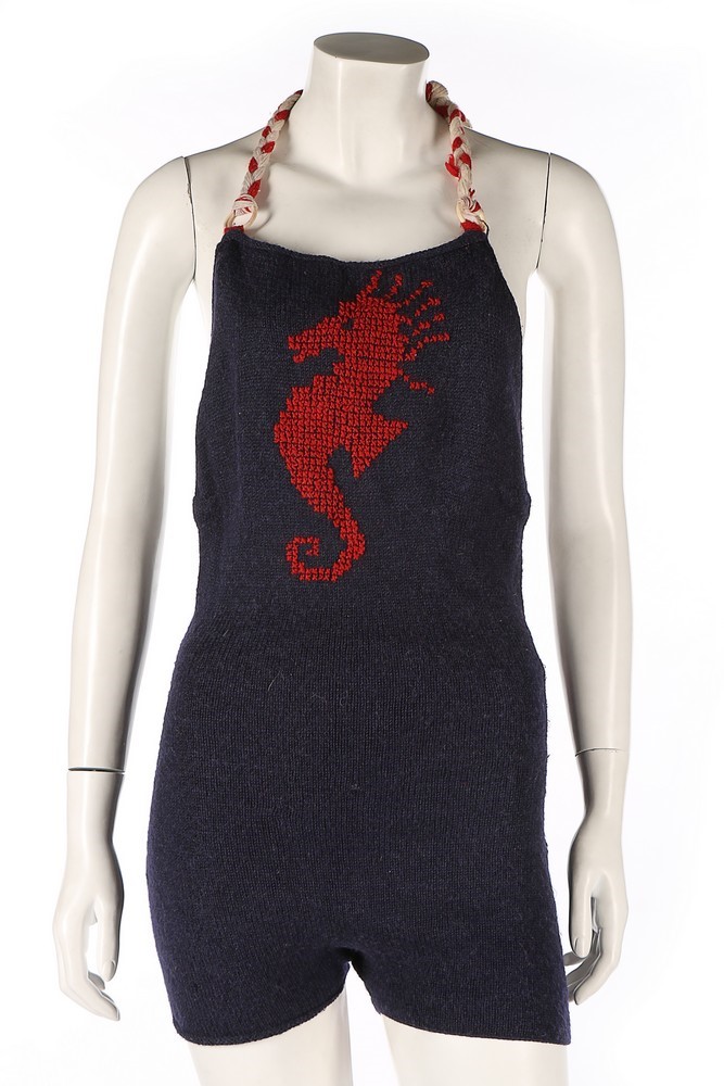 Lot 269 - A hand-knitted navy wool swimsuit with red