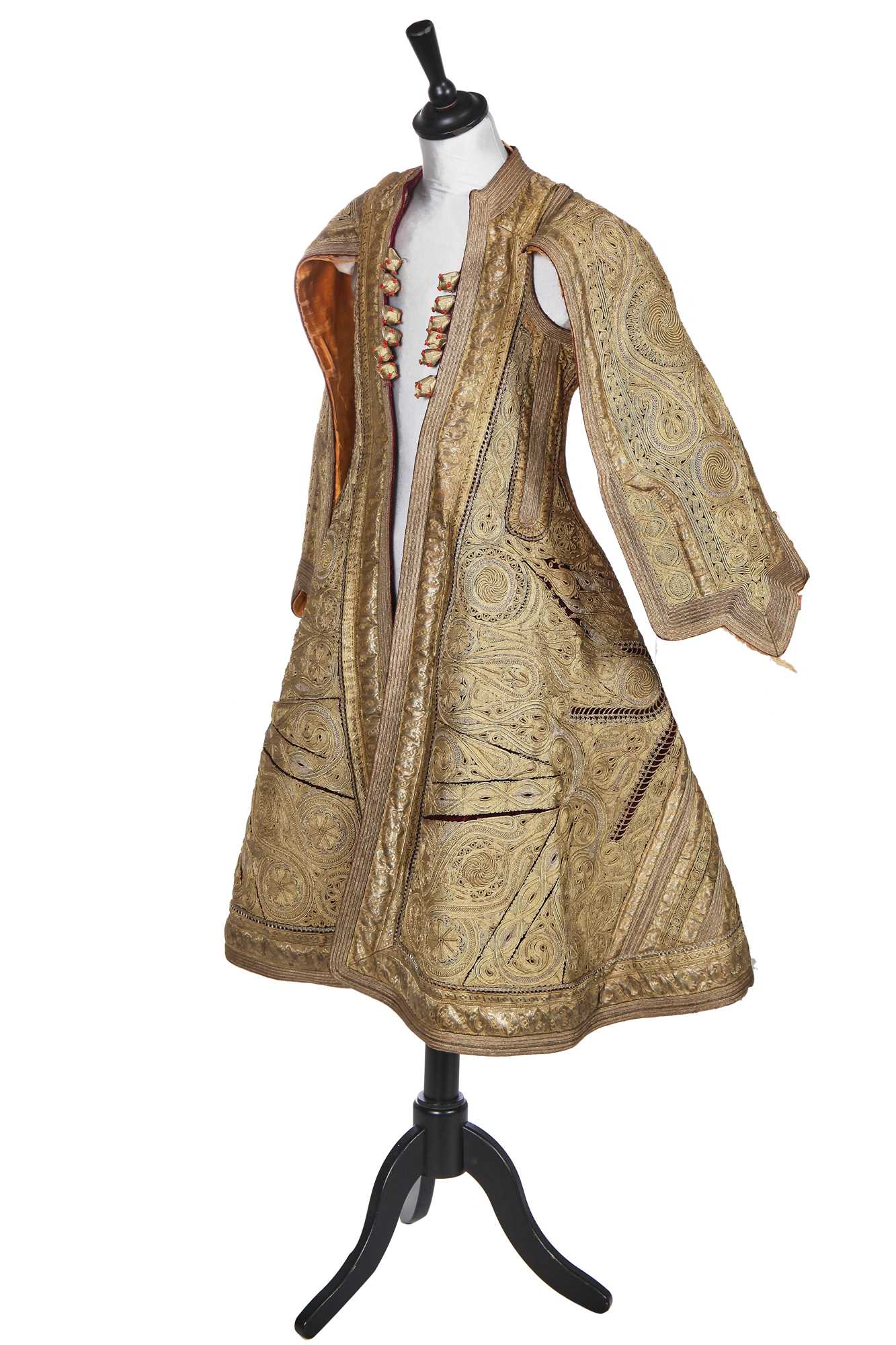 Lot 500 - An embroidered burgundy velvet surcoat,