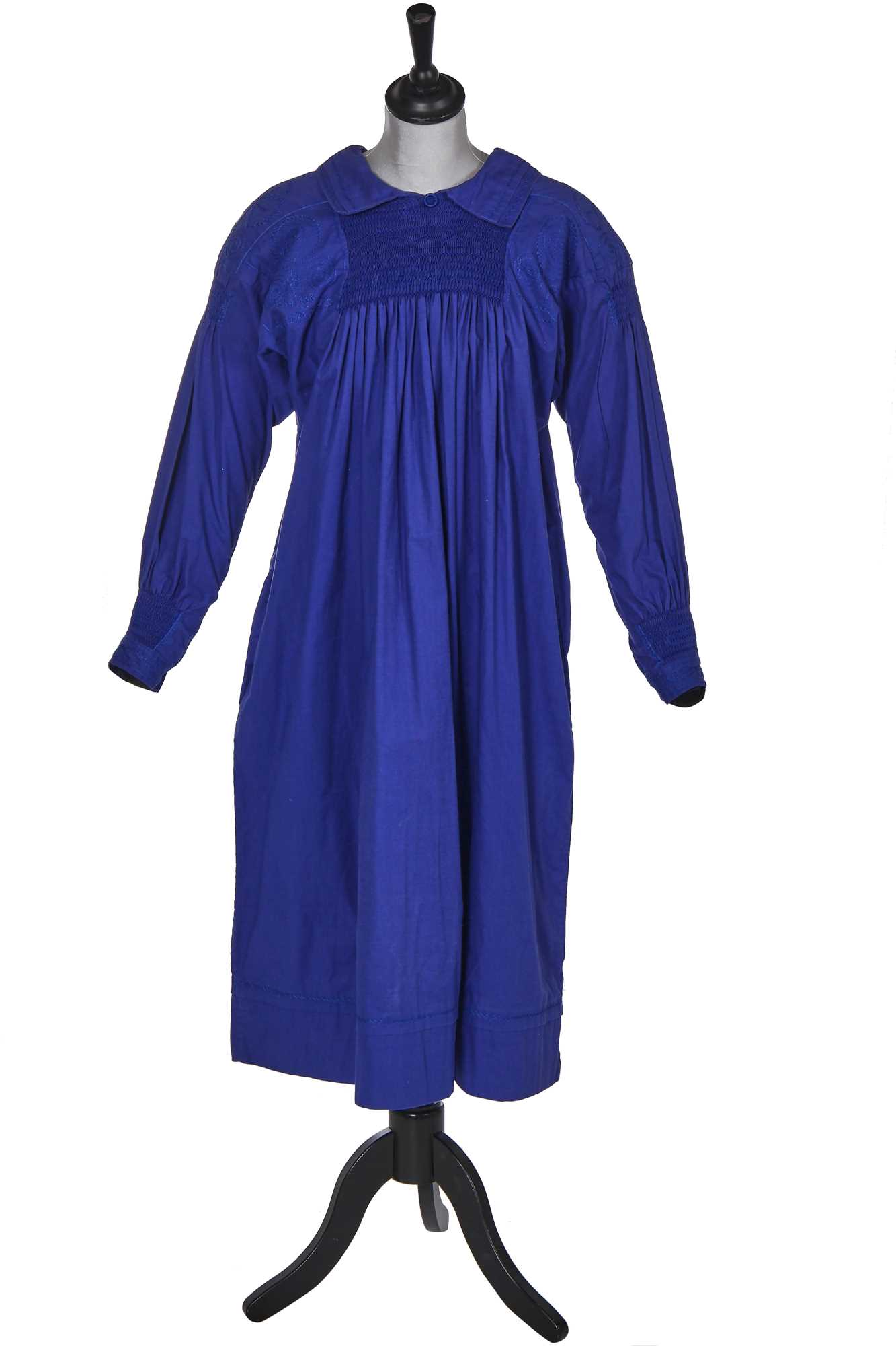 Lot 451 - An embroidered blue cotton farmer's smock,