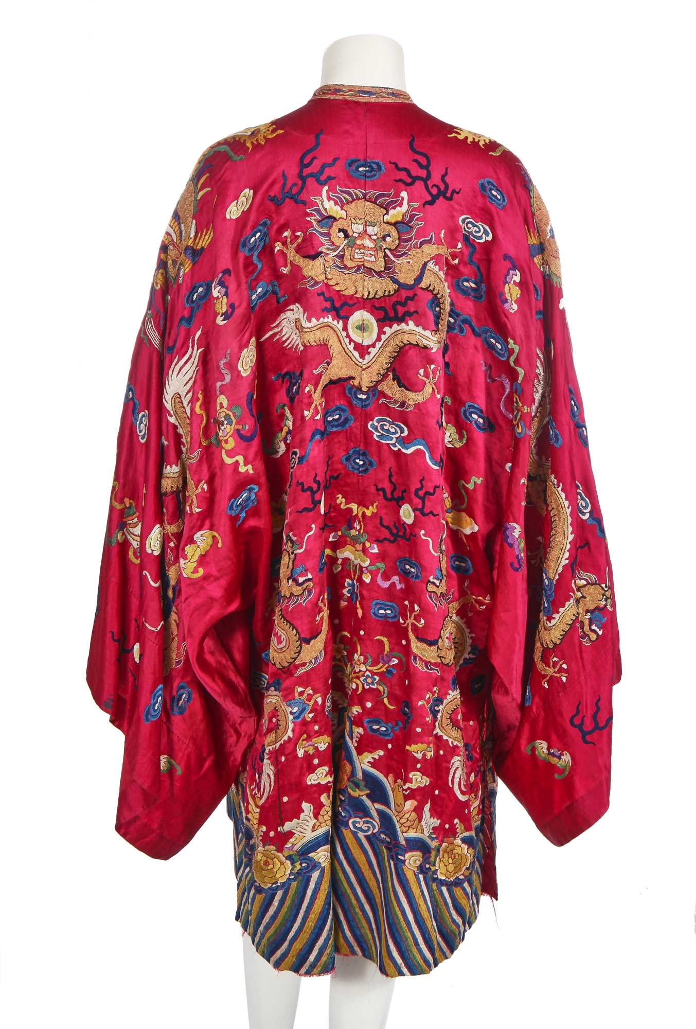 Lot 460 - A woman's fuchsia silk dragon robe, mangpao,