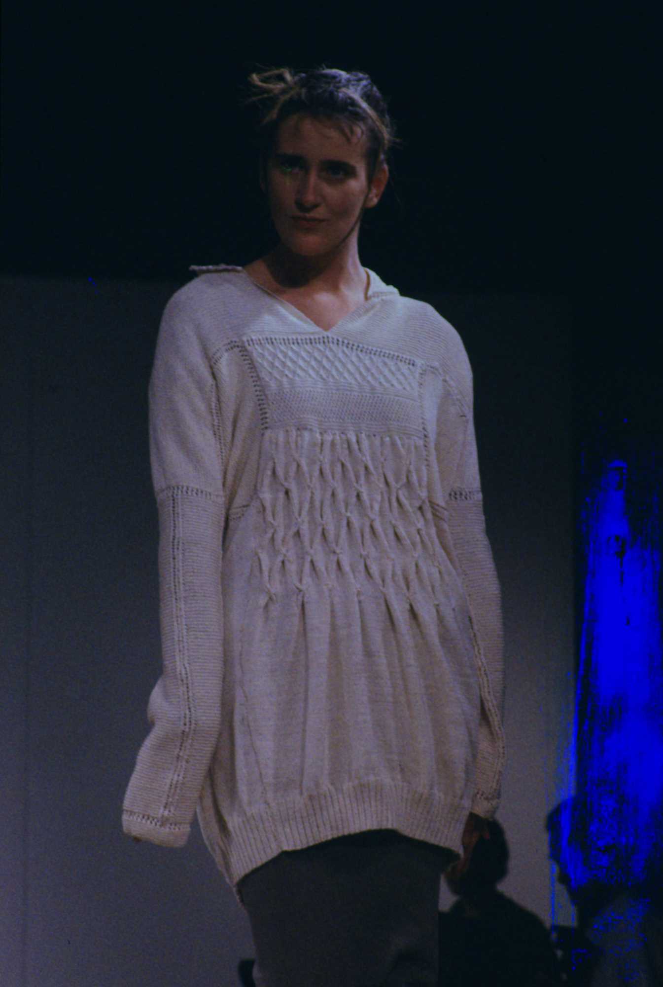 Lot 334 - A John Galliano white knitted wool jumper,