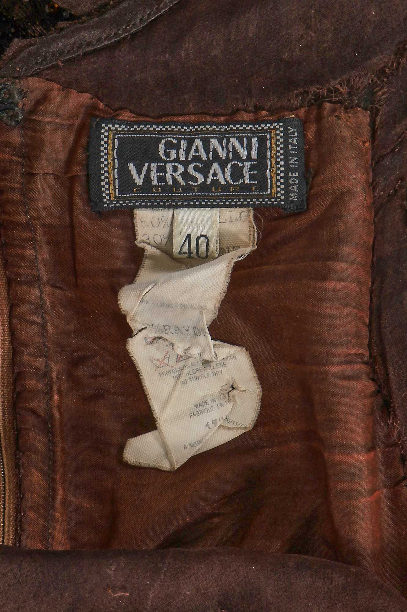 Lot 189 - A fine Gianni Versace brown Oroton dress,
