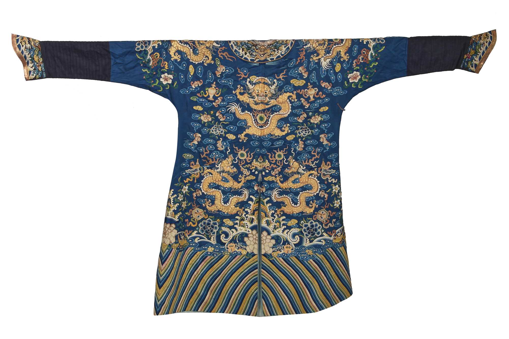 Lot 530 - An embroidered blue silk ground dragon robe,
