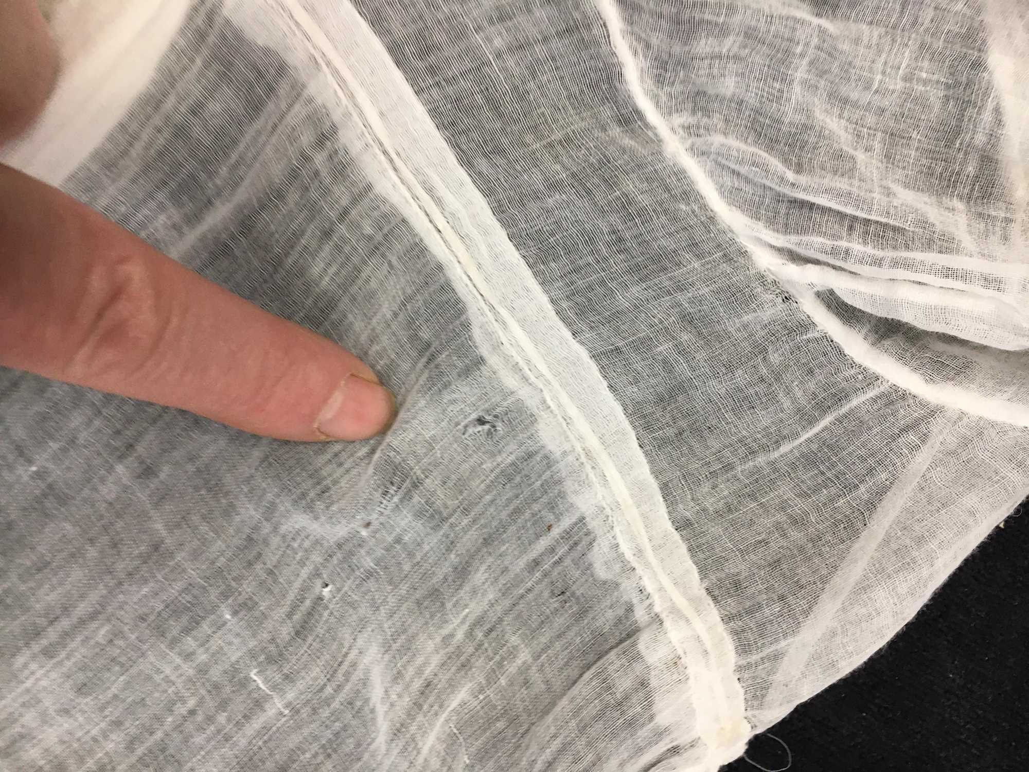 Lot 39 - A fine Indian muslin evening dress with long