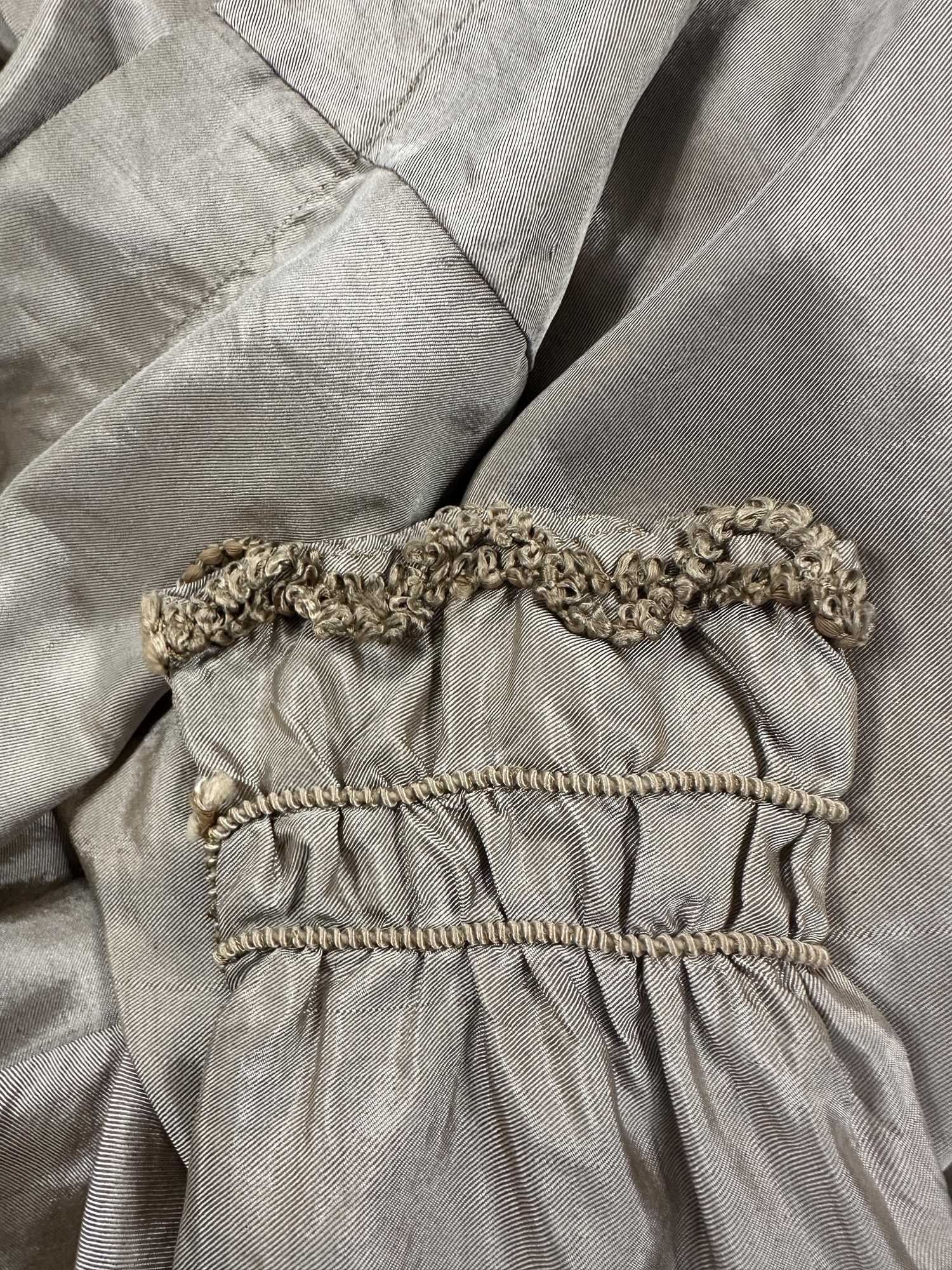 Lot 95 - A taupe twill shot sarsanet evening dress,