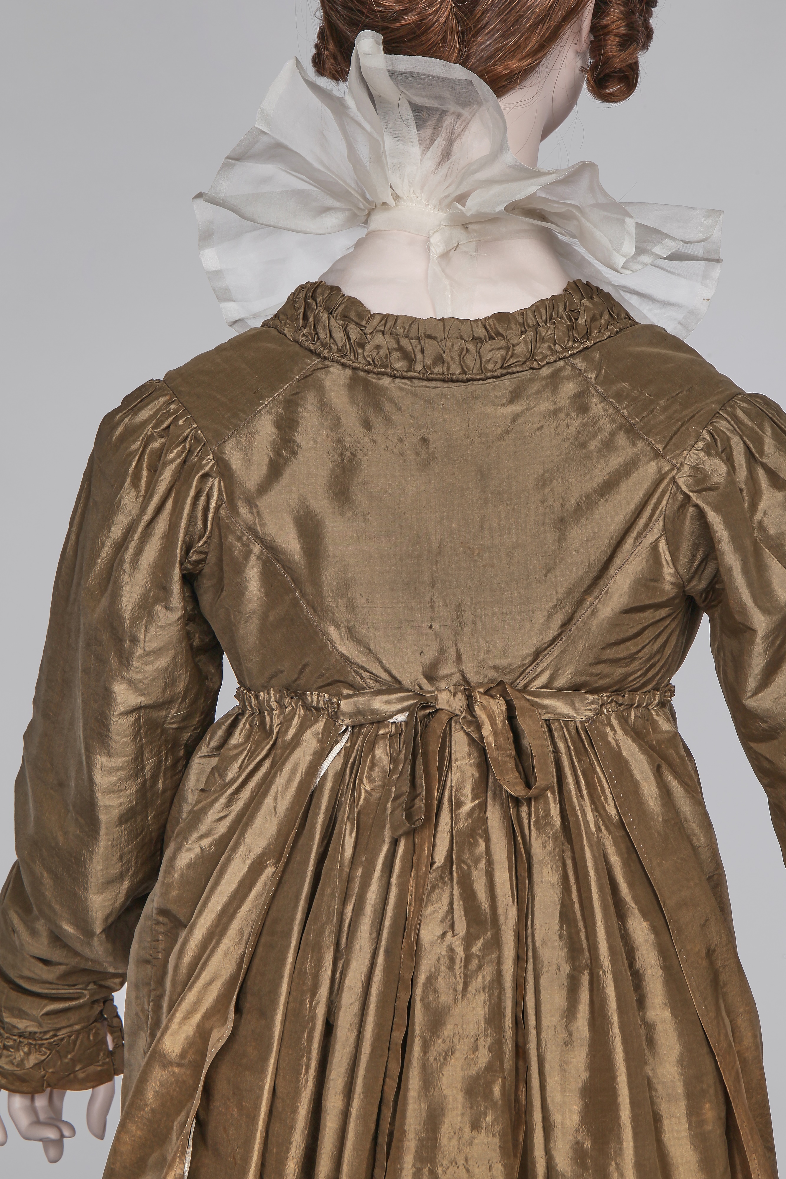 Lot 82 - A green-brown shot silk taffeta dress, French,