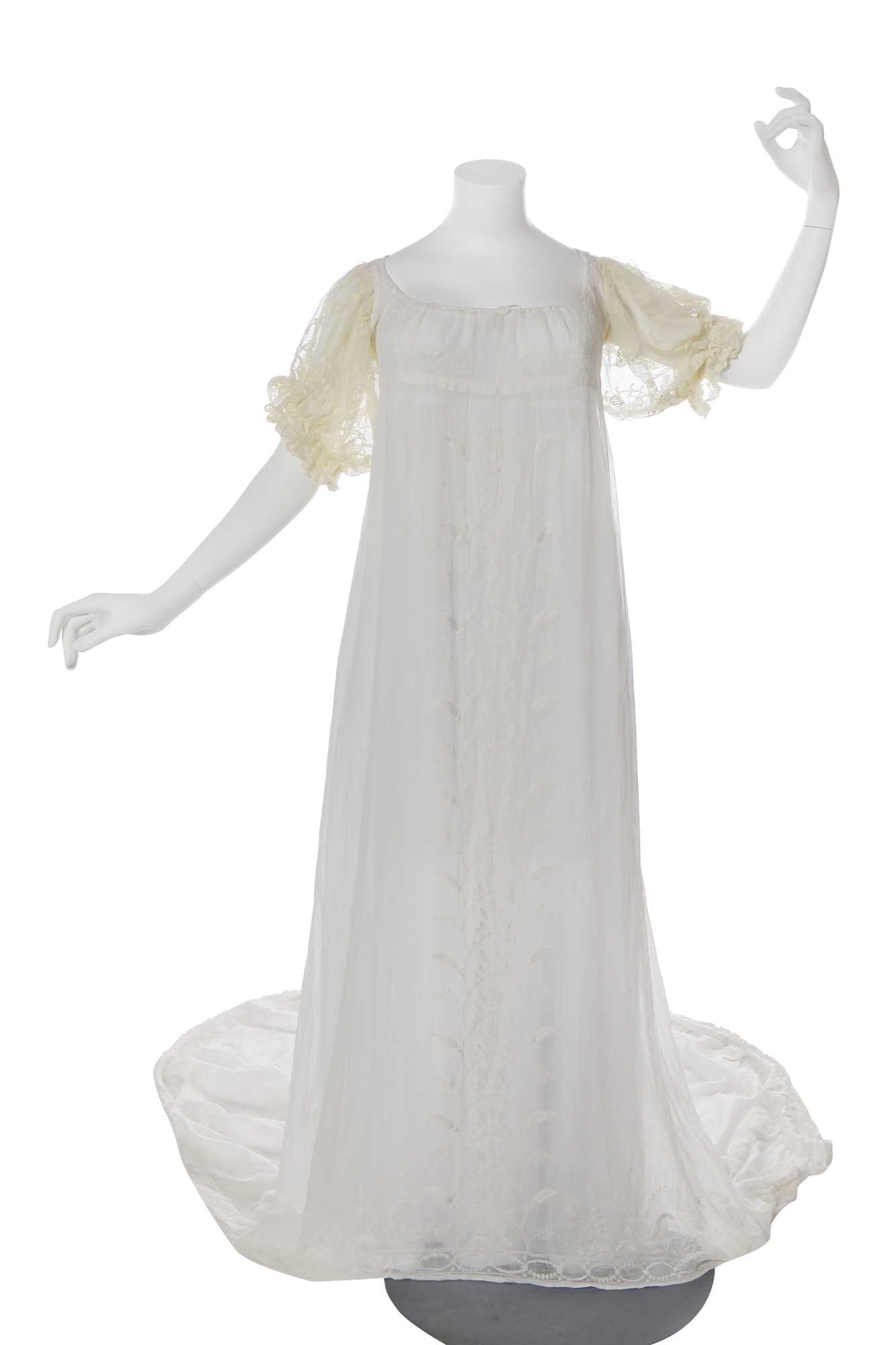 Lot 512 - An embroidered muslin frock with train,