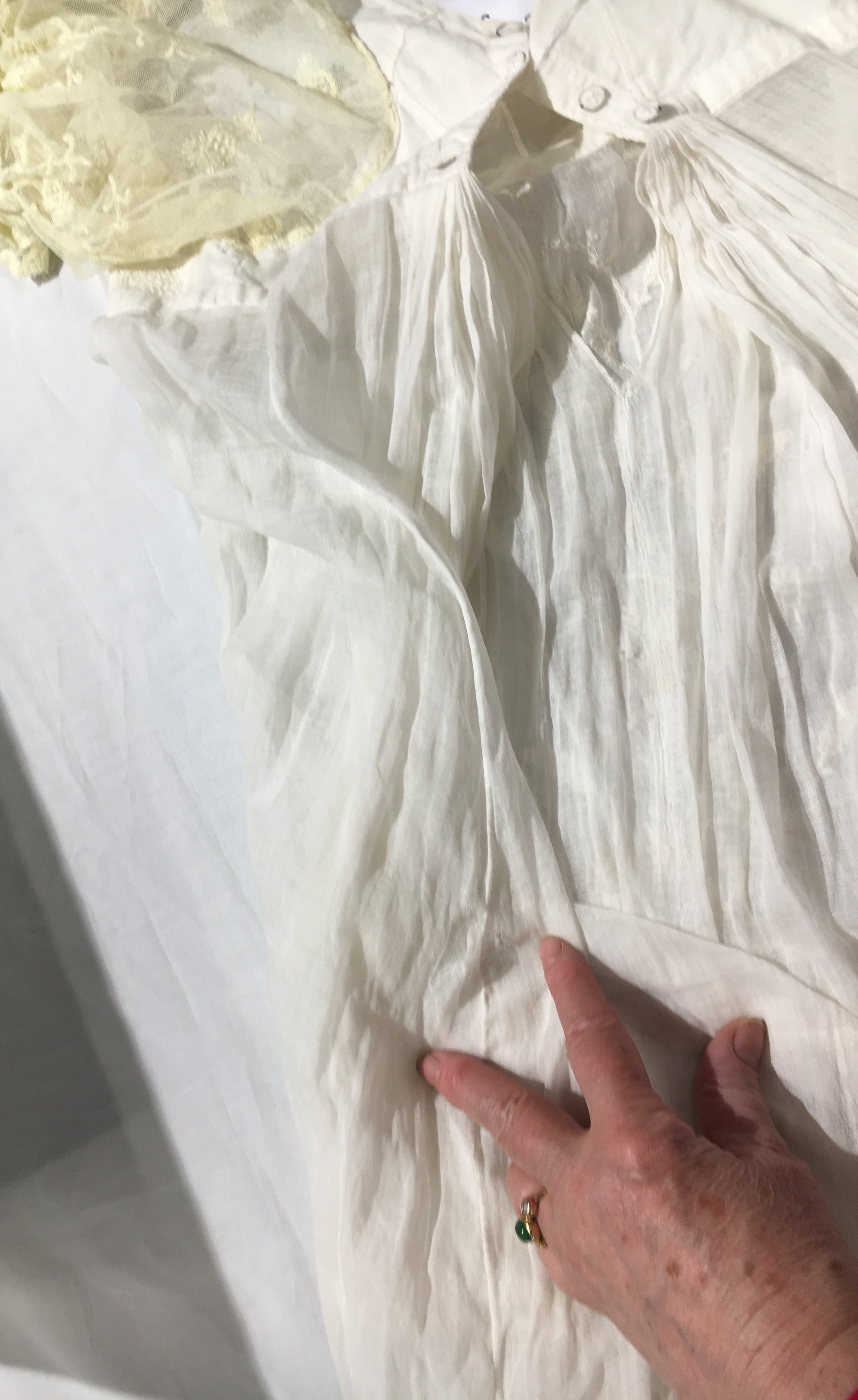 Lot 512 - An embroidered muslin frock with train,