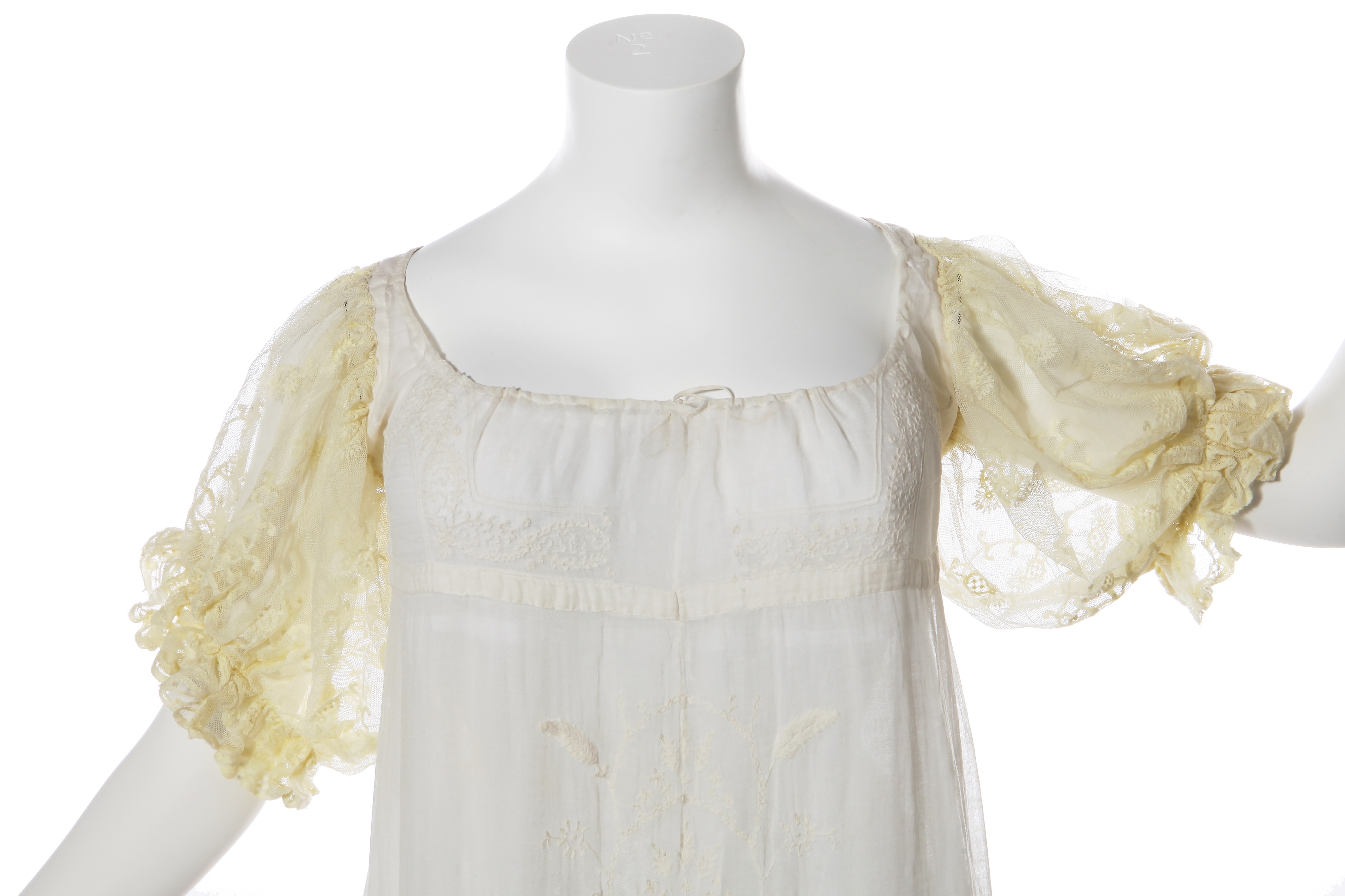 Lot 512 - An embroidered muslin frock with train,