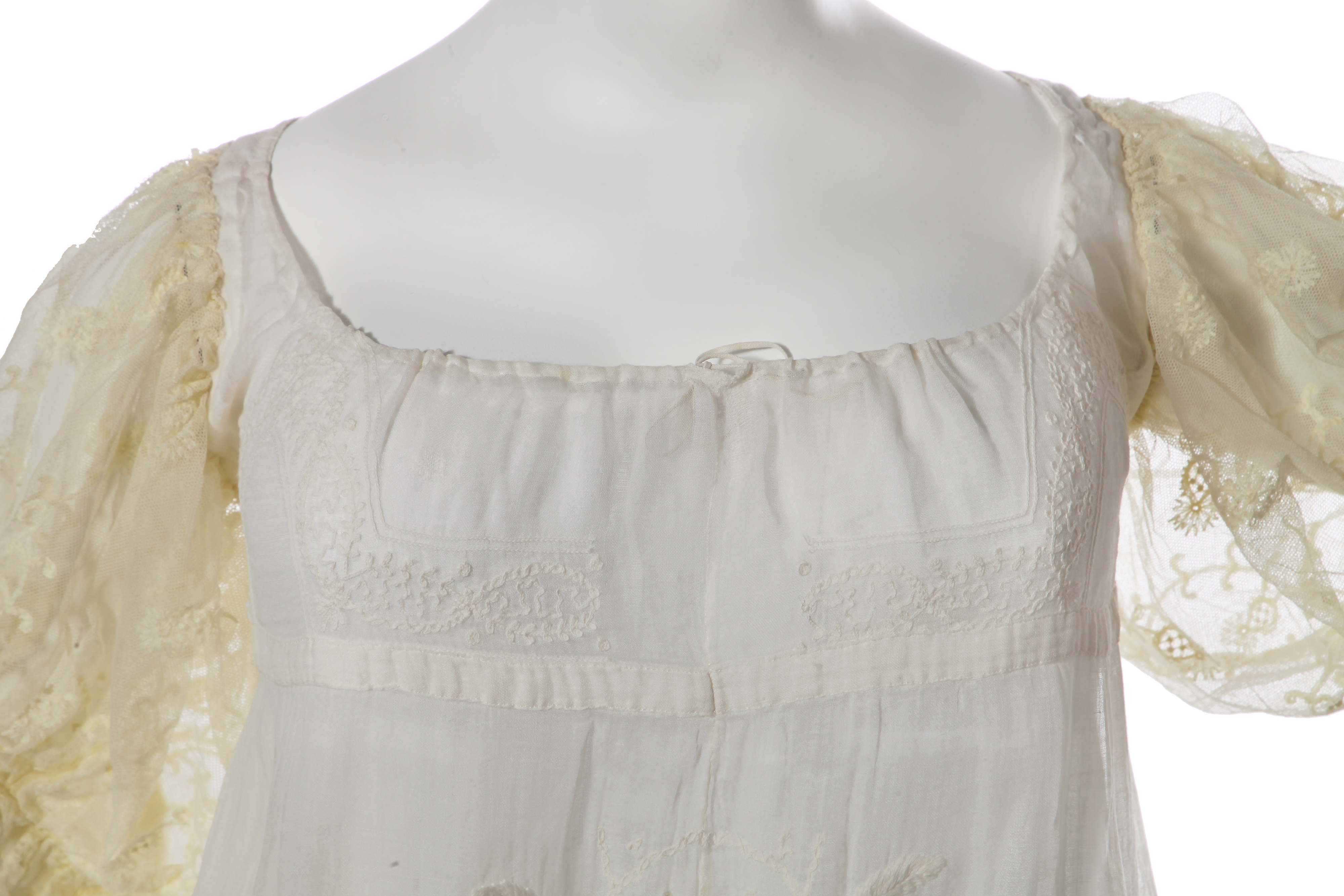 Lot 512 - An embroidered muslin frock with train,
