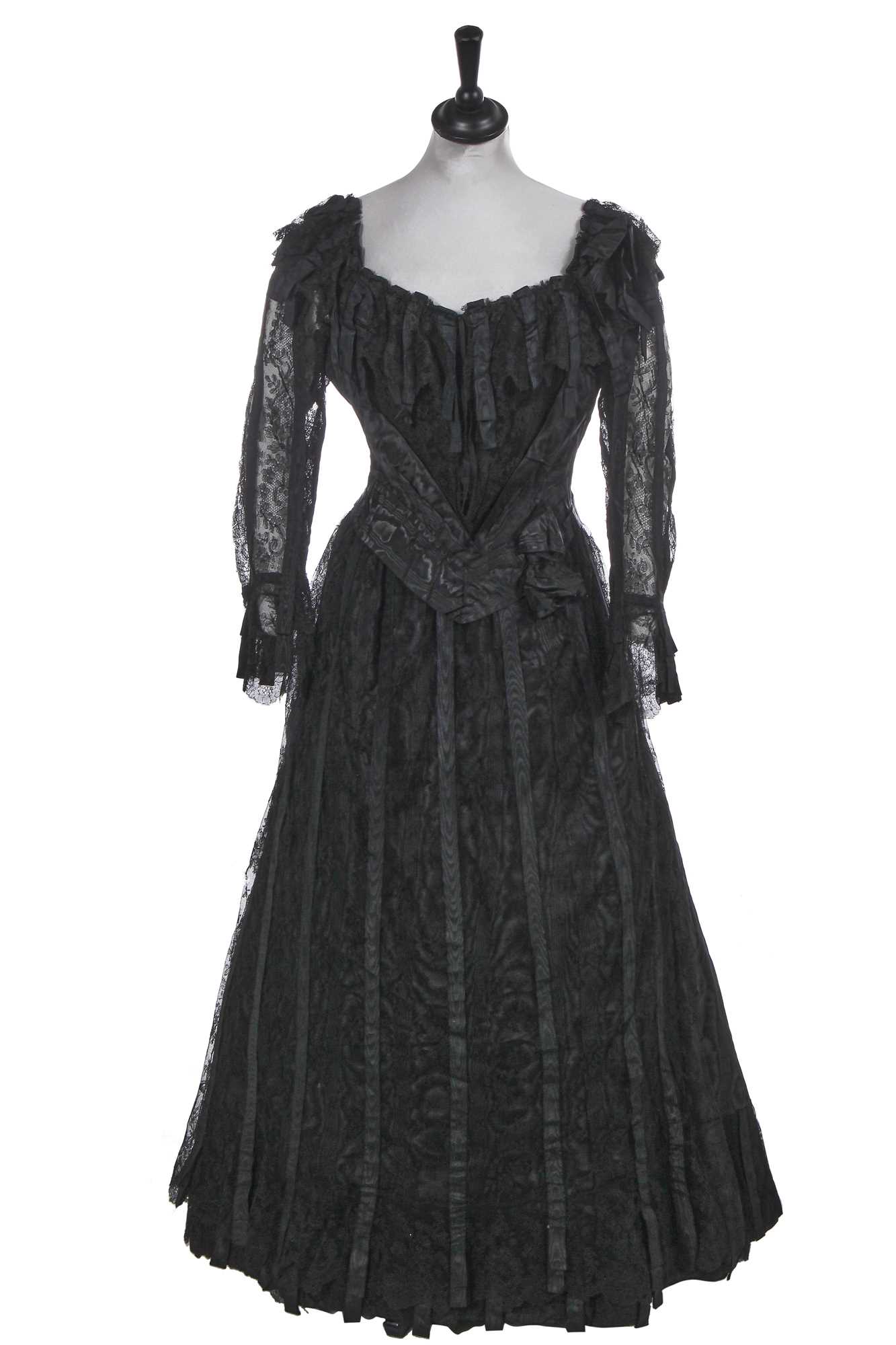 Lot 475 - An Emile Pingat black lace and moiré gown,