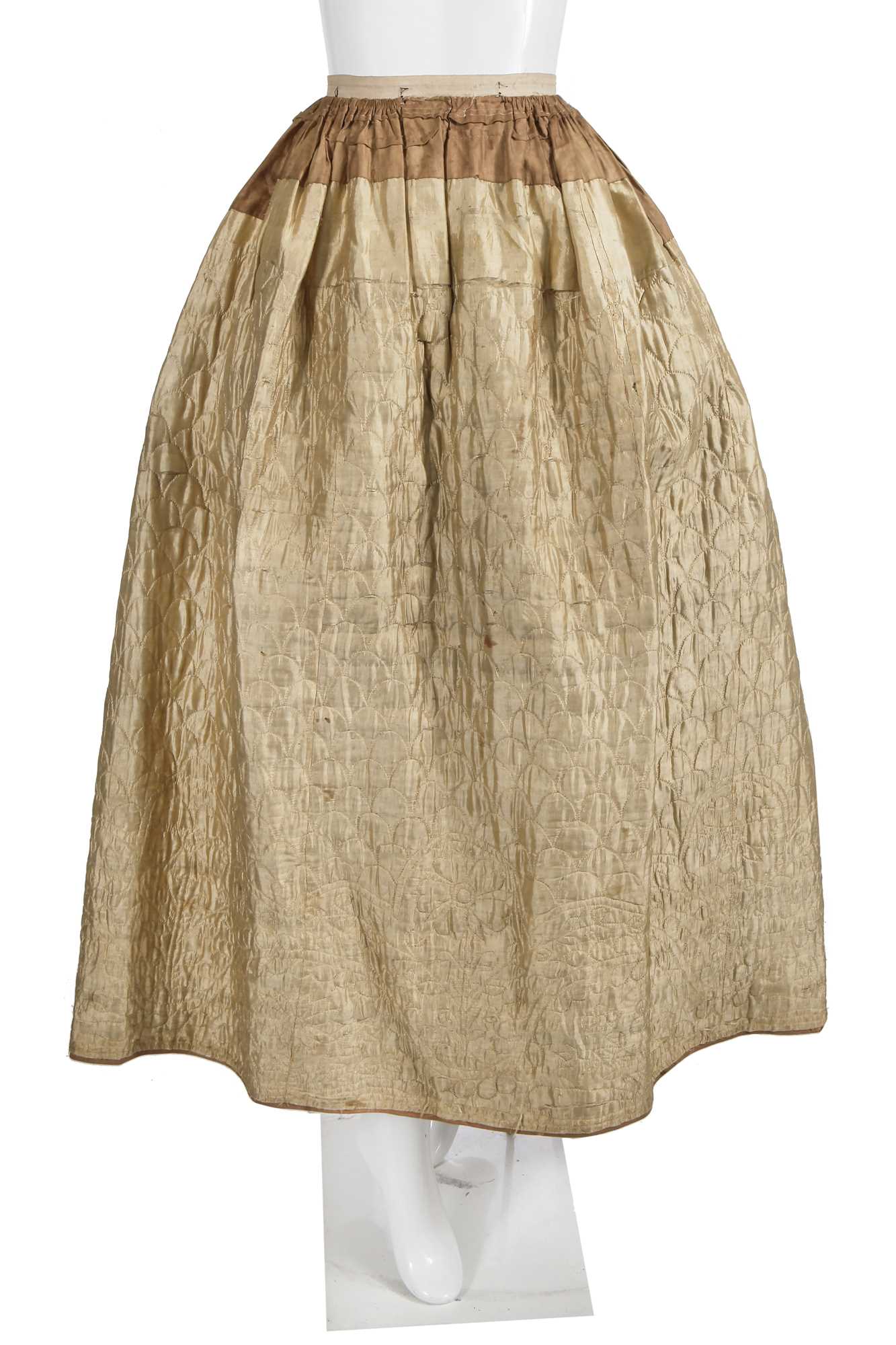 Lot 531 - A quilted golden-tan silk petticoat, 18th
