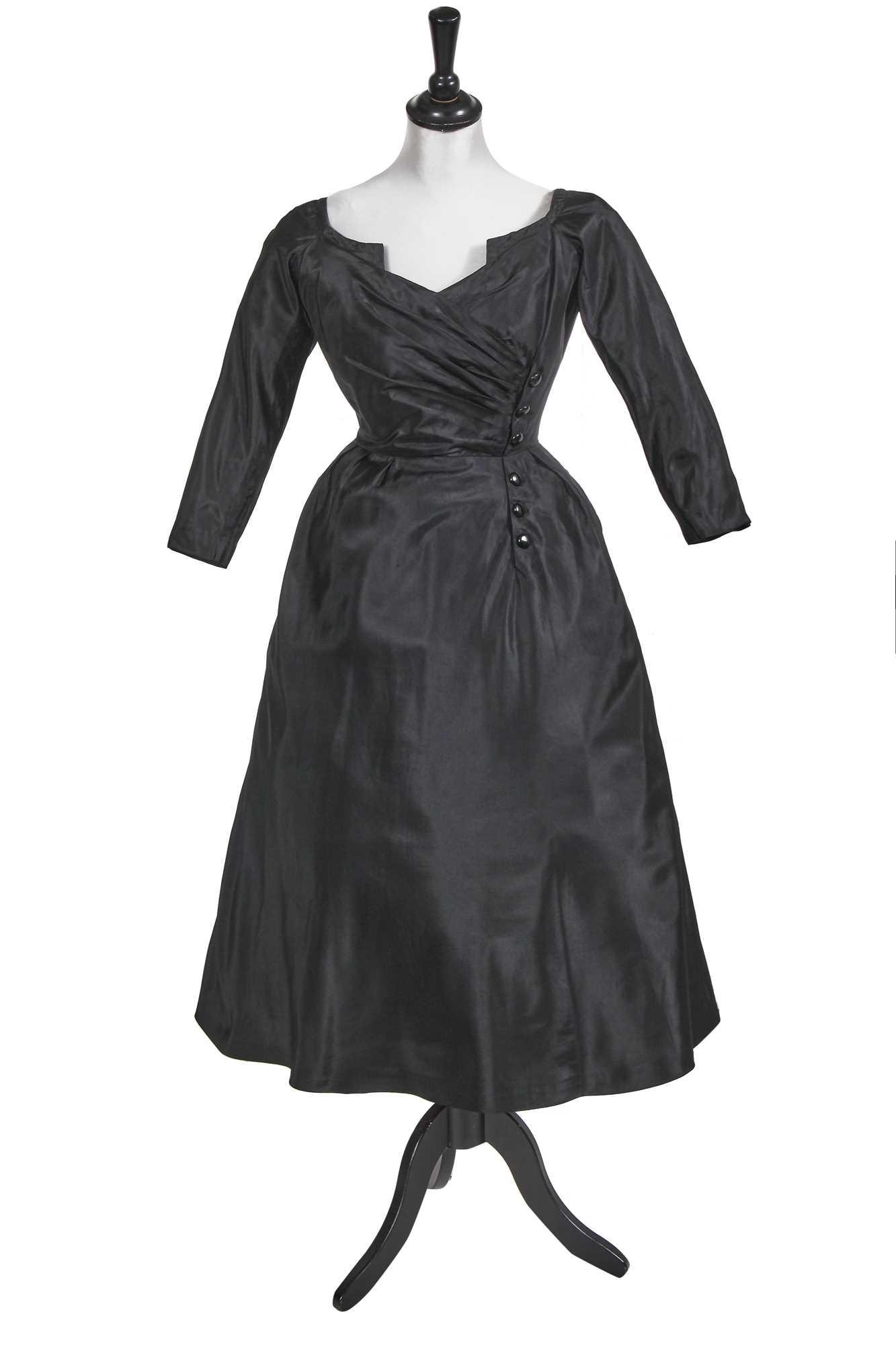 Lot 436 - A Jacques Fath haute couture black taffeta