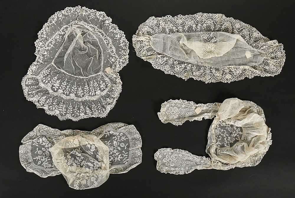 Lot 467 - A group of lace and whiteworked bonnets,