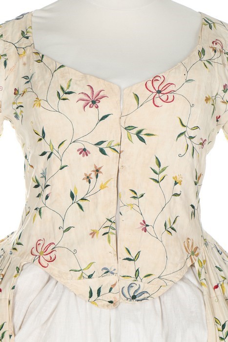 Lot 40 - An embroidered linen open robe, English,