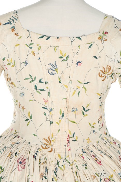 Lot 40 - An embroidered linen open robe, English,